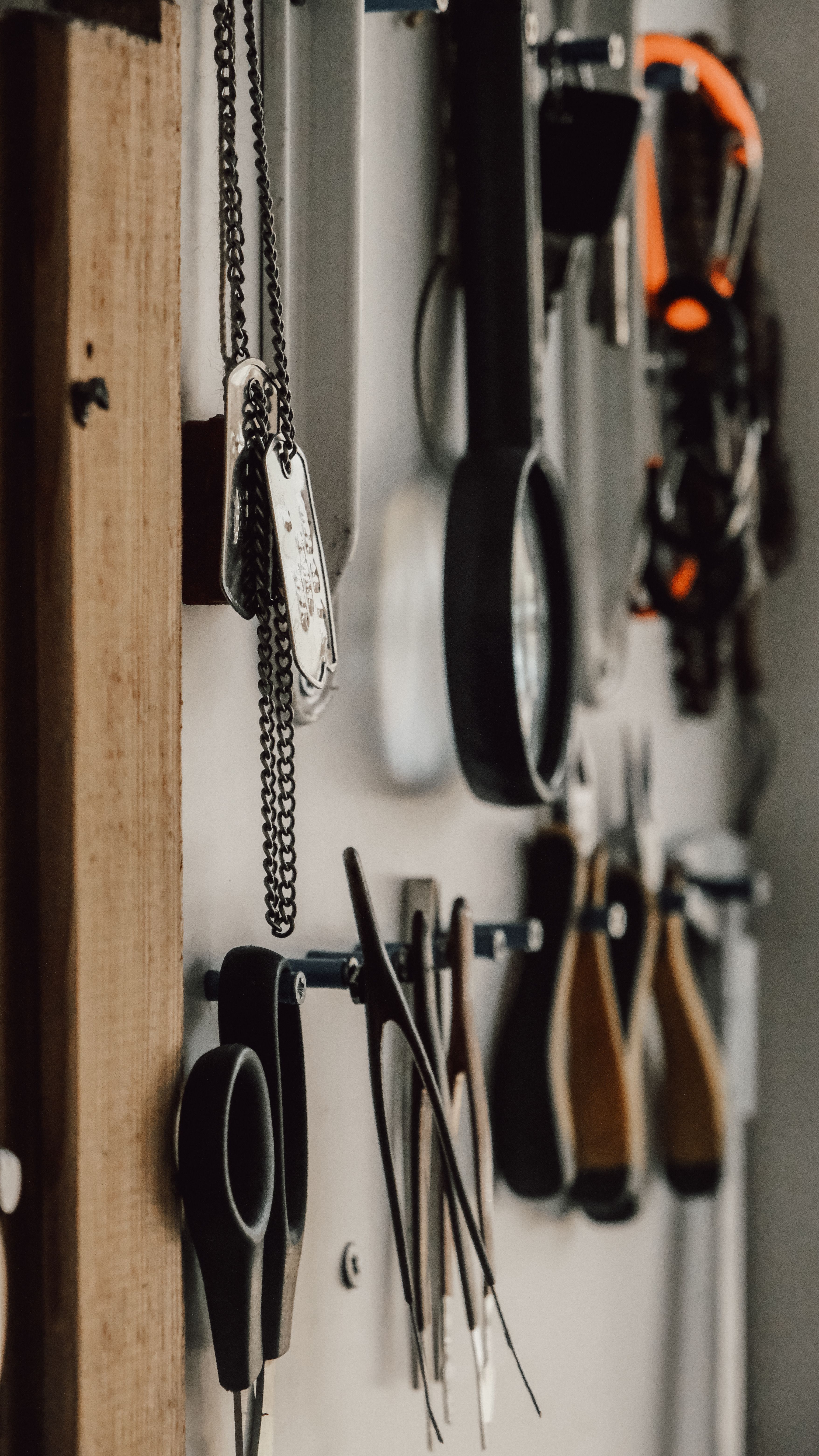 Military Name Tag Hanging among Tools in Garage · Free Stock Photo