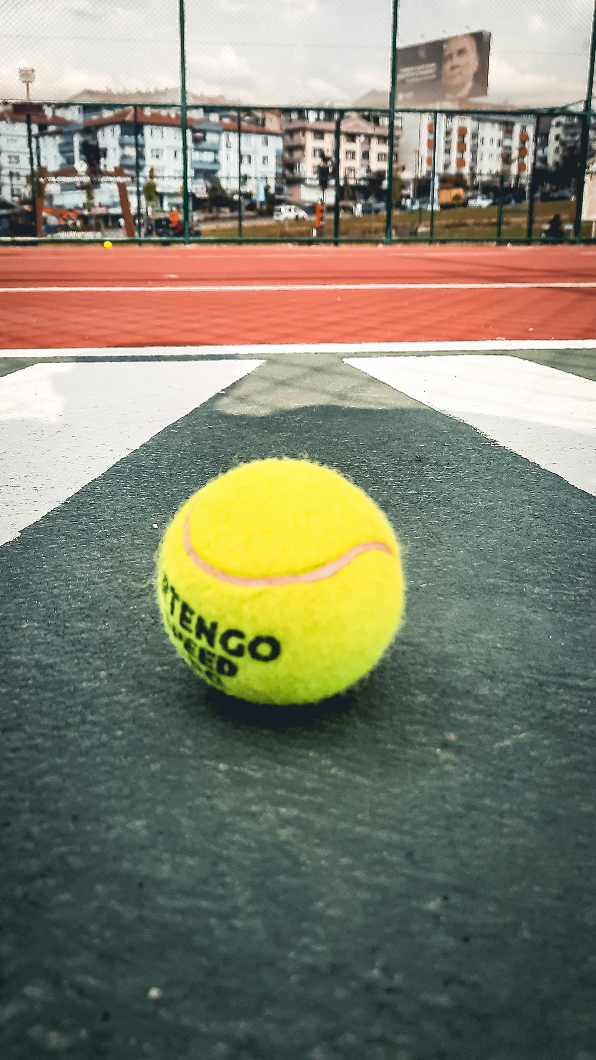 Tennis Ball on Ground · Free Stock Photo