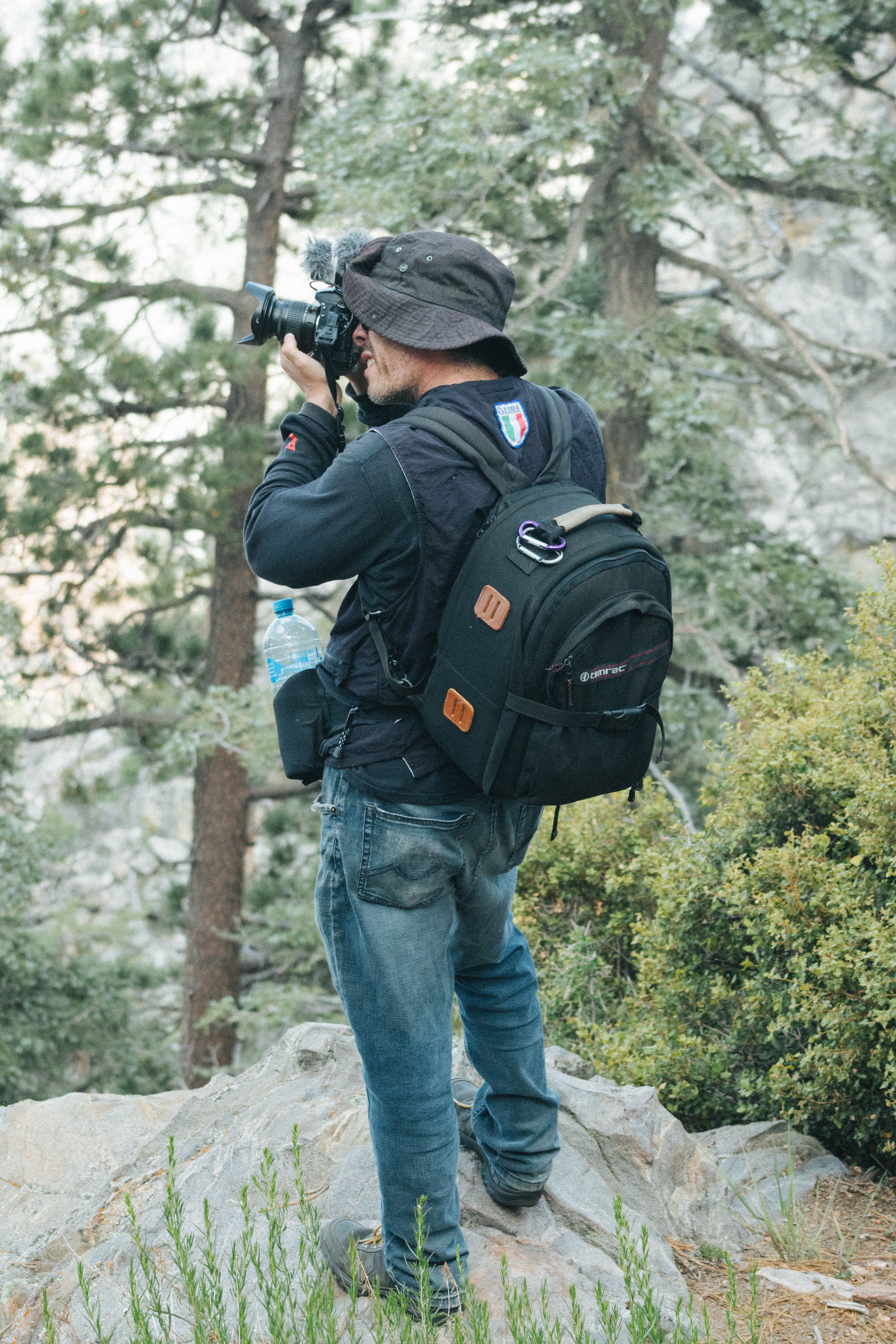 Backpacker Taking Photo of Nature with Digital Camera · Free Stock Photo