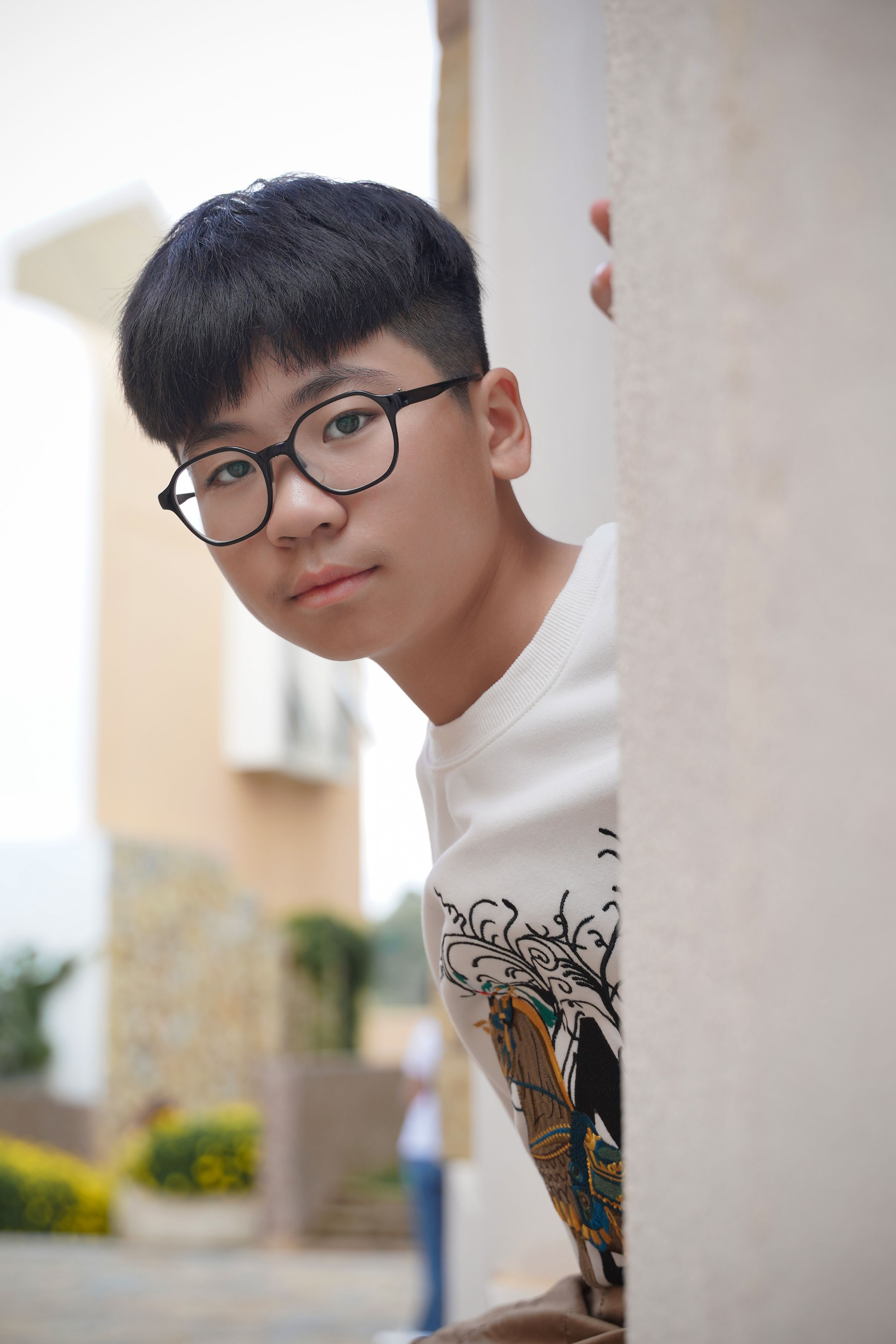 Boy Looking Out from Behind the Wall · Free Stock Photo