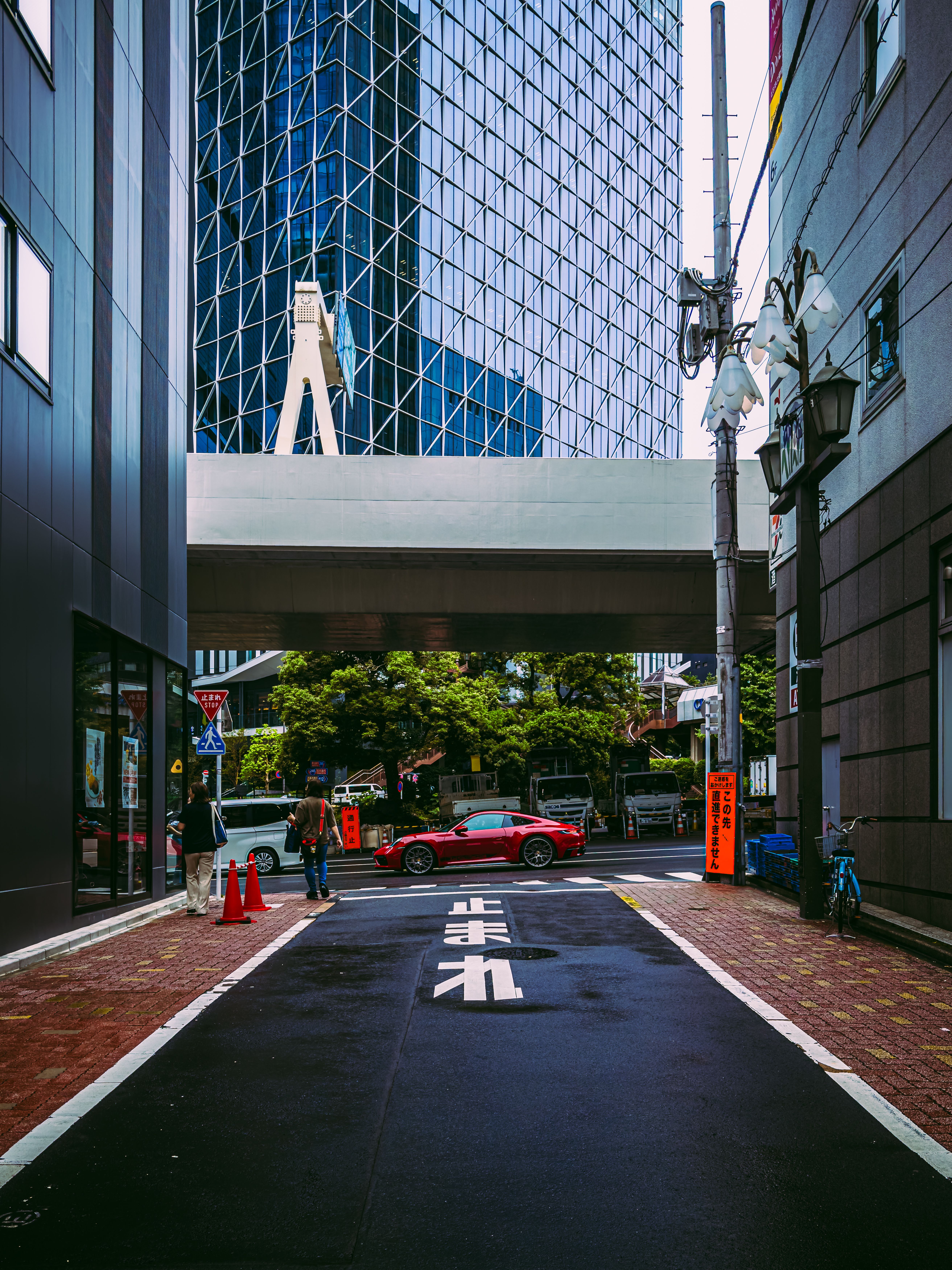 Intersection and Overpass in front of Shibuya Axsh Building in Tokyo ...