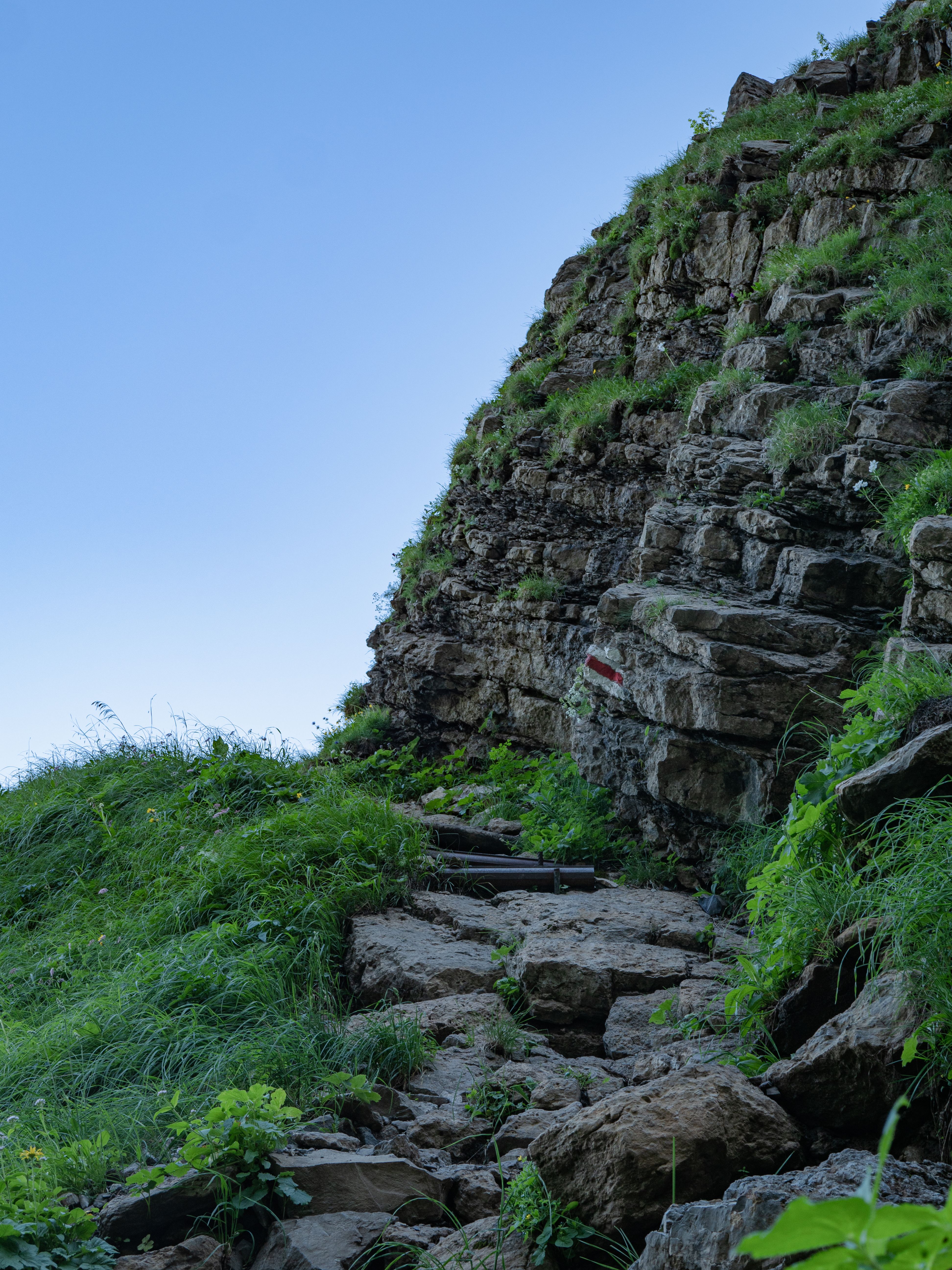 A rocky path leading up to a cliff · Free Stock Photo