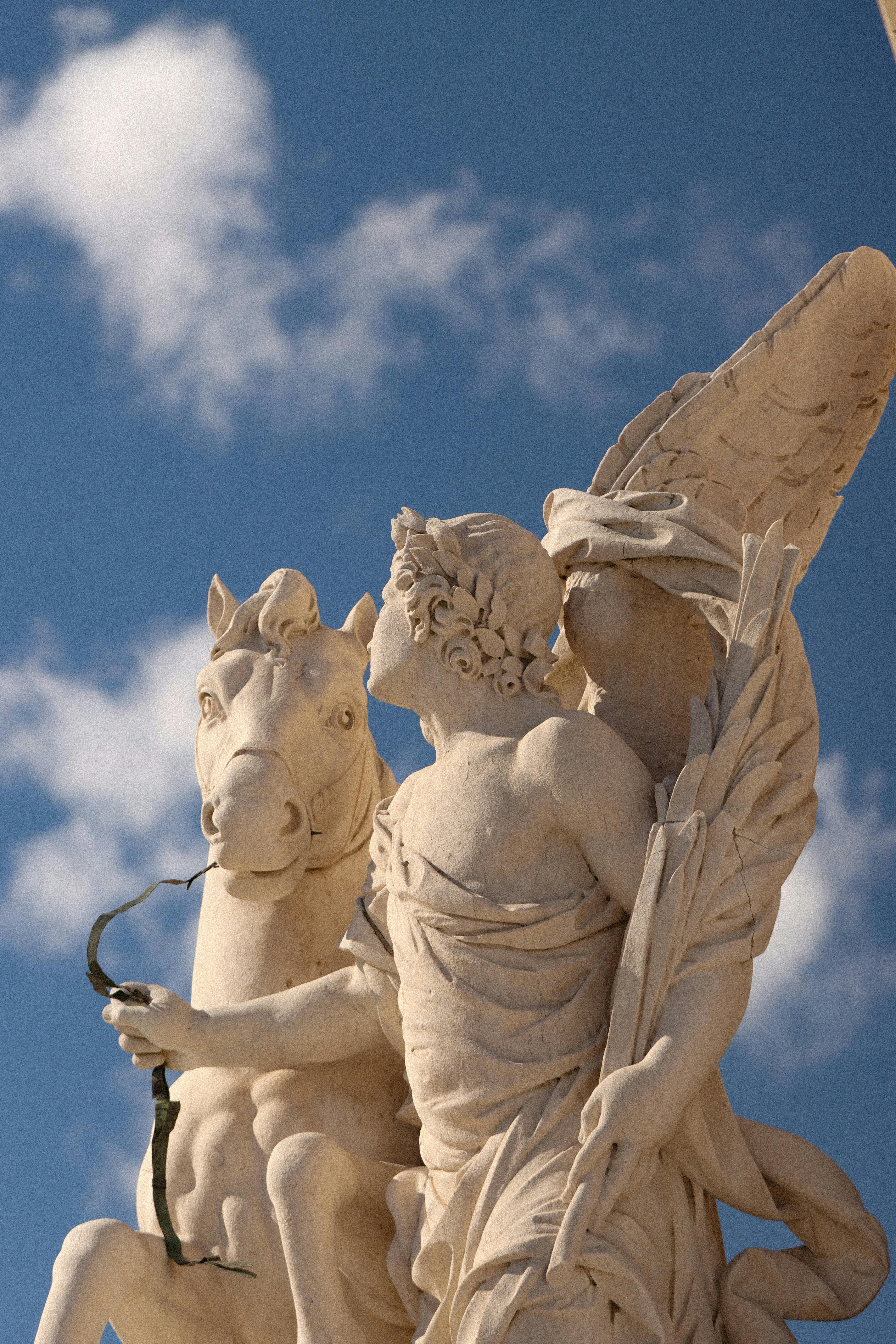 White Statue of an Angel with a Horse · Free Stock Photo