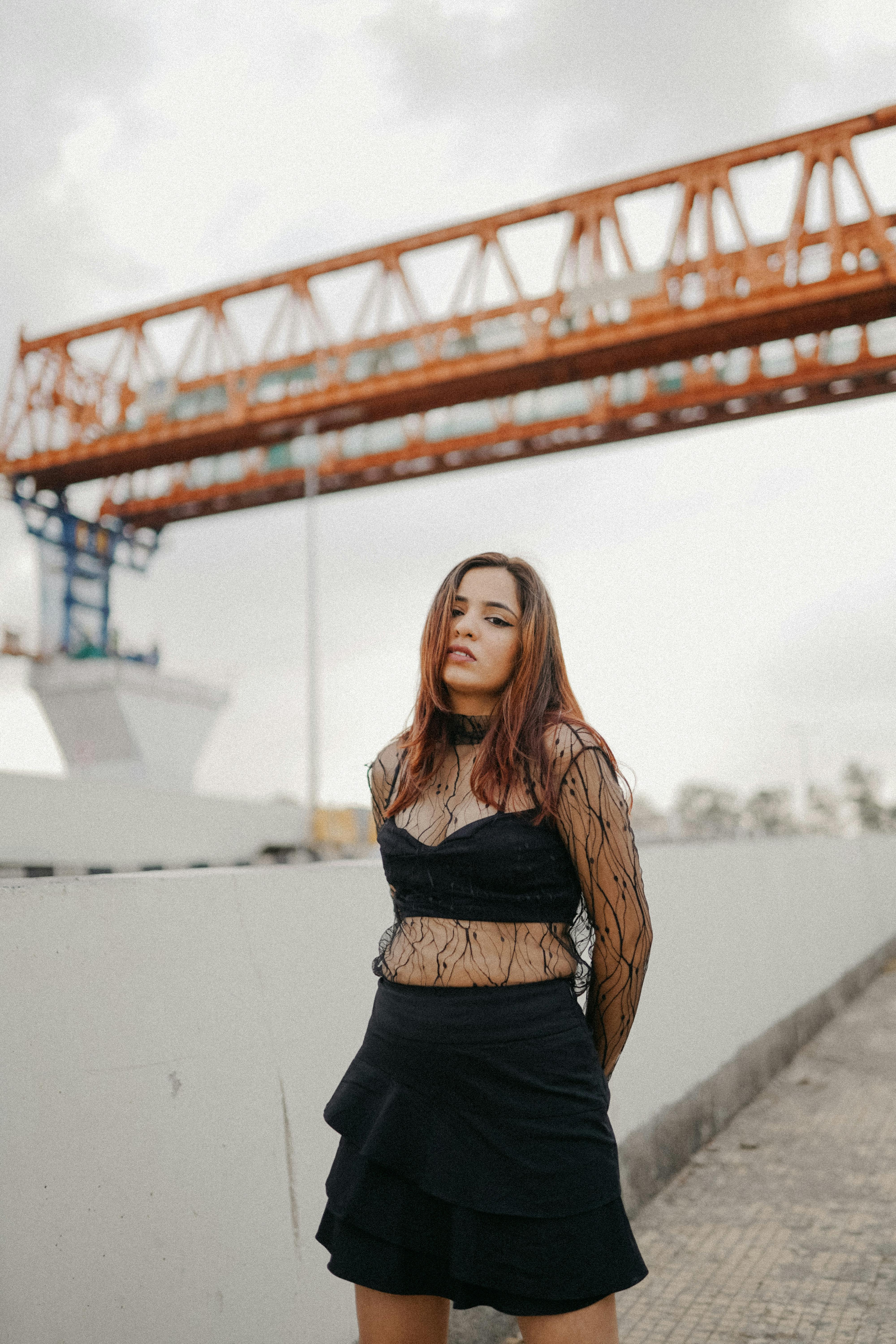 Female Model Wearing a Black Translucent Dress Standing Outdoors · Free ...