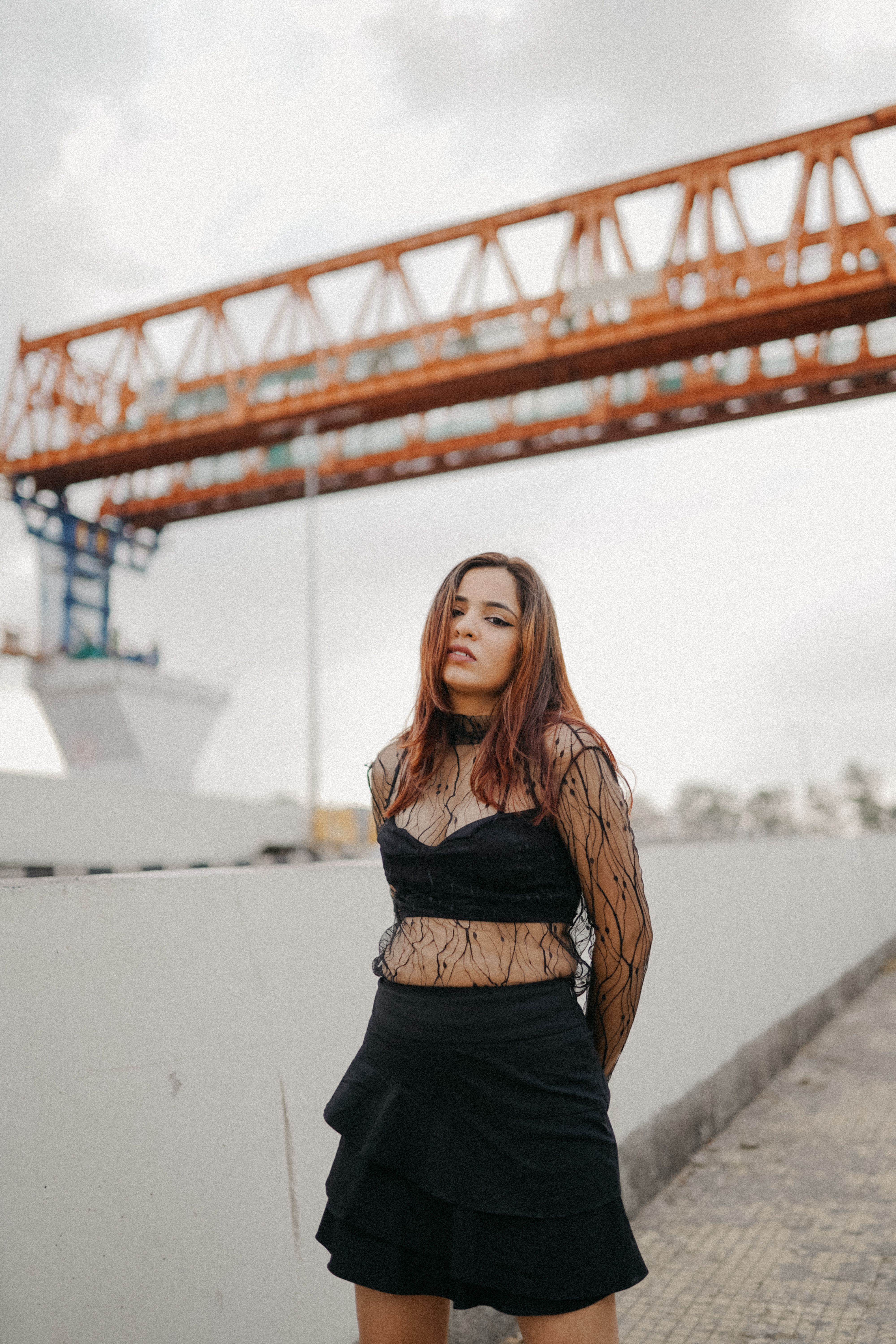 Female Model Wearing a Black Translucent Dress Standing Outdoors · Free ...
