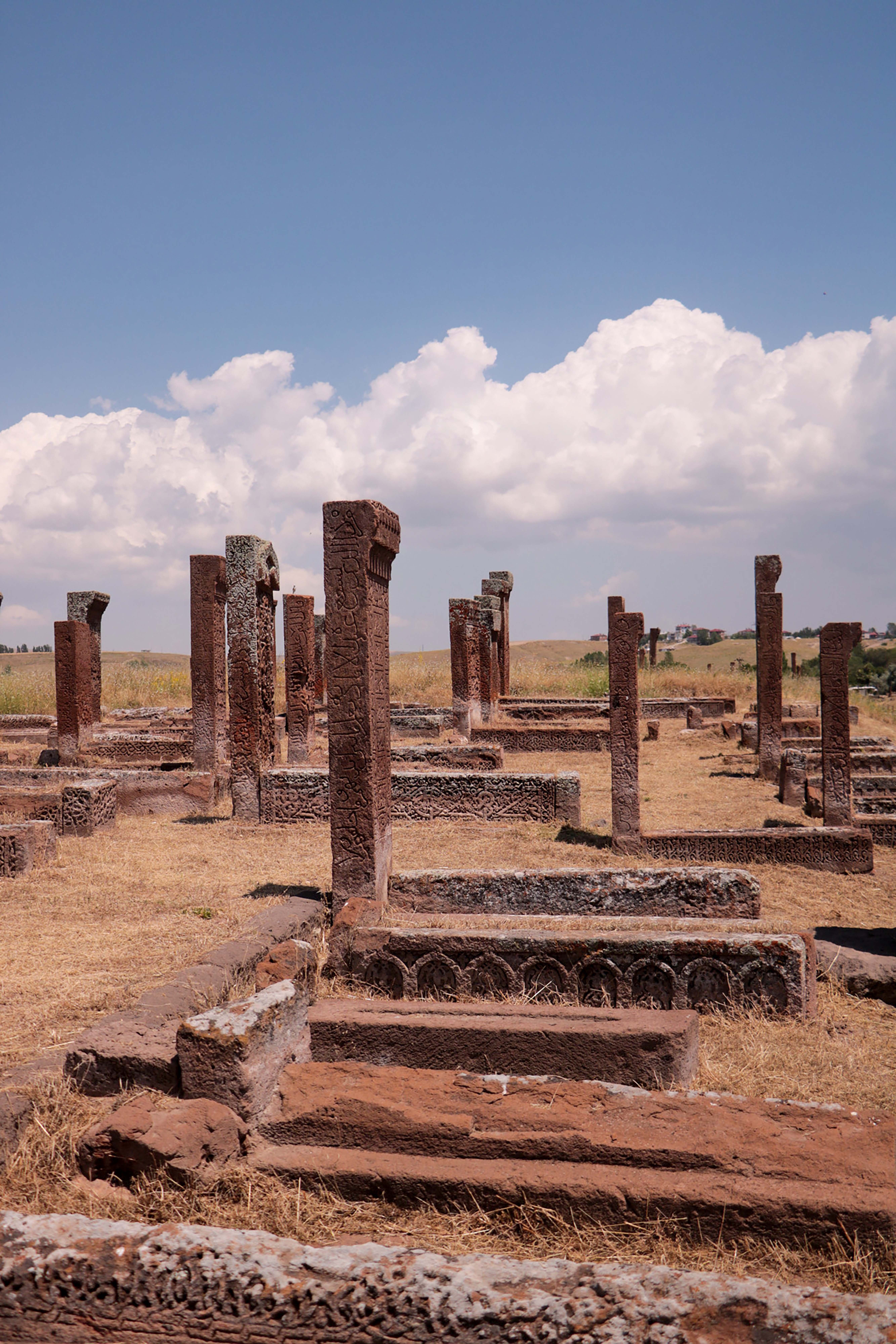 The ruins of a temple in the middle of a field · Free Stock Photo