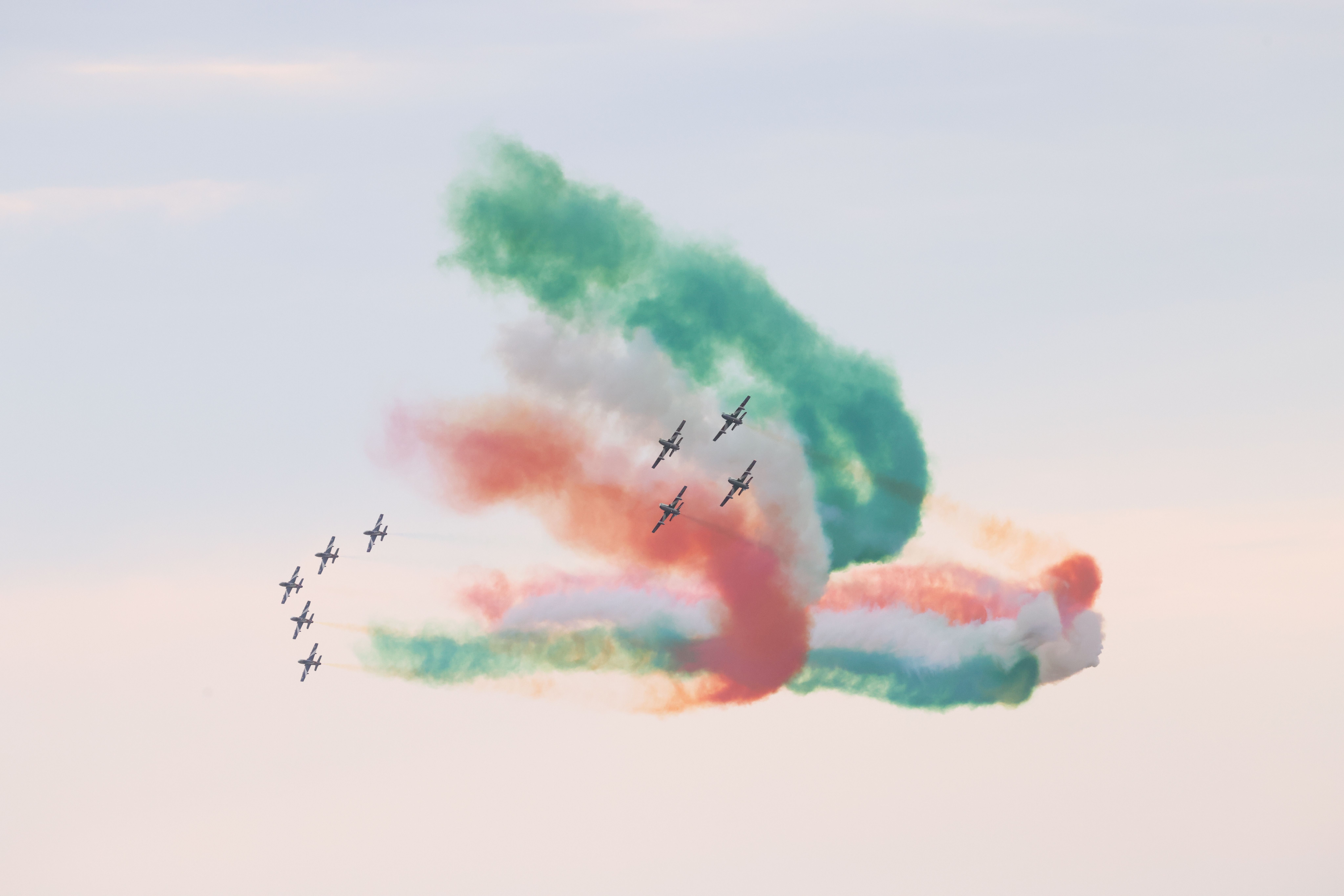 A group of planes flying in formation with colorful smoke · Free Stock ...