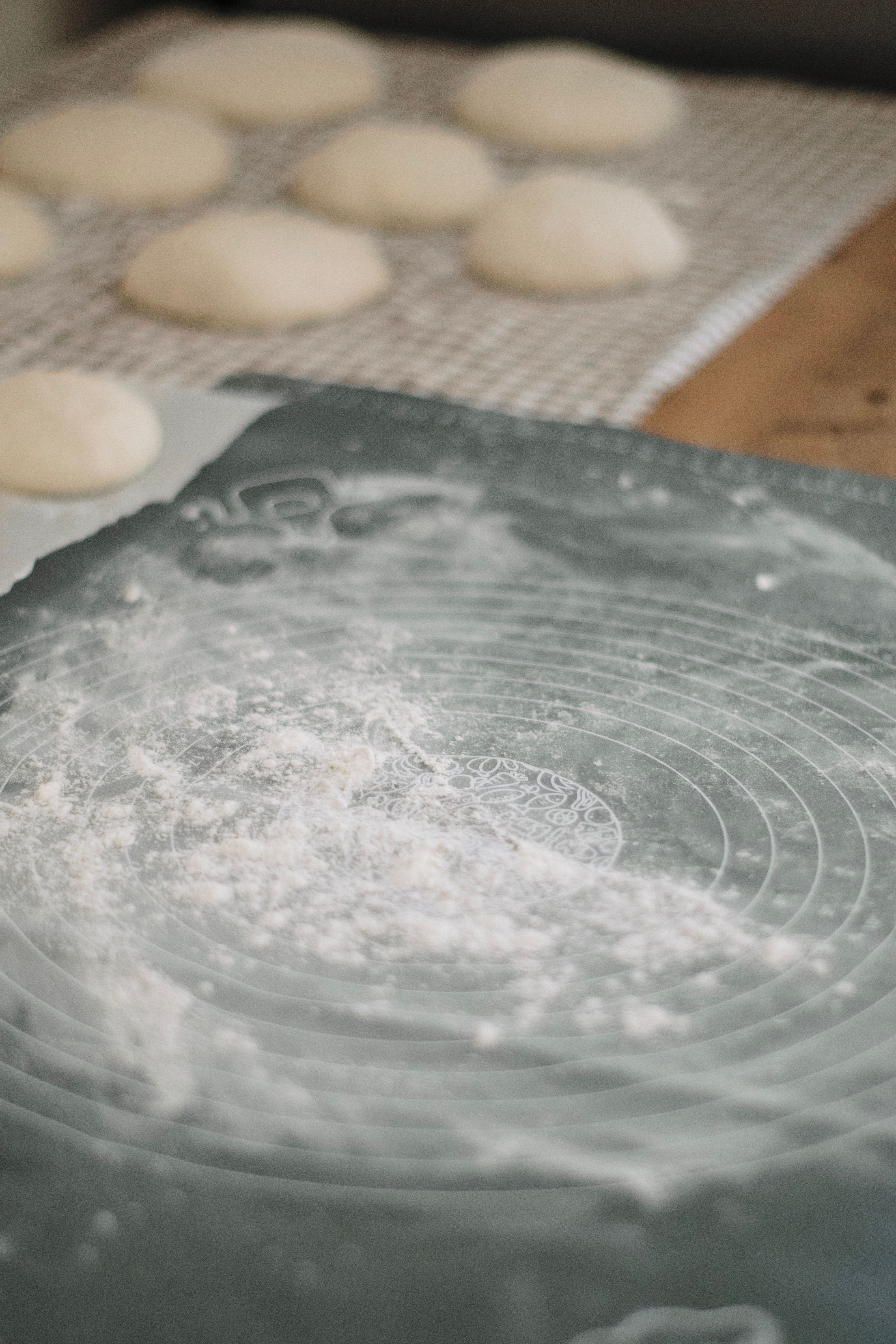 Kitchen Cloth Dusted with Flour Next to the Raw Dough Rolls · Free ...