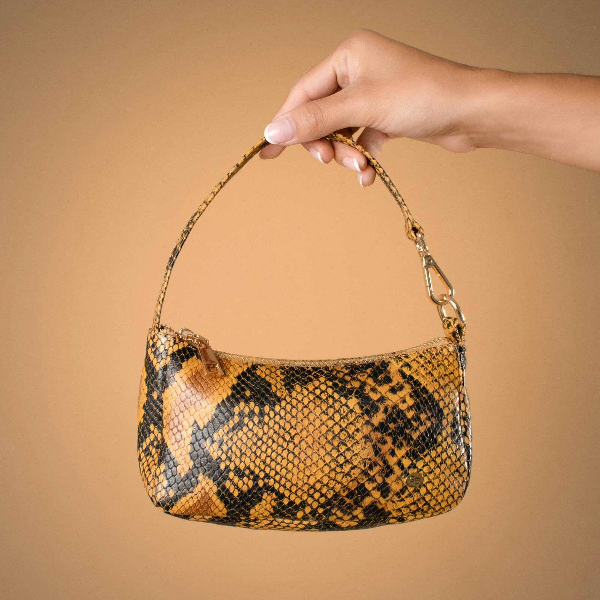 Woman Hand Holding Bag · Free Stock Photo