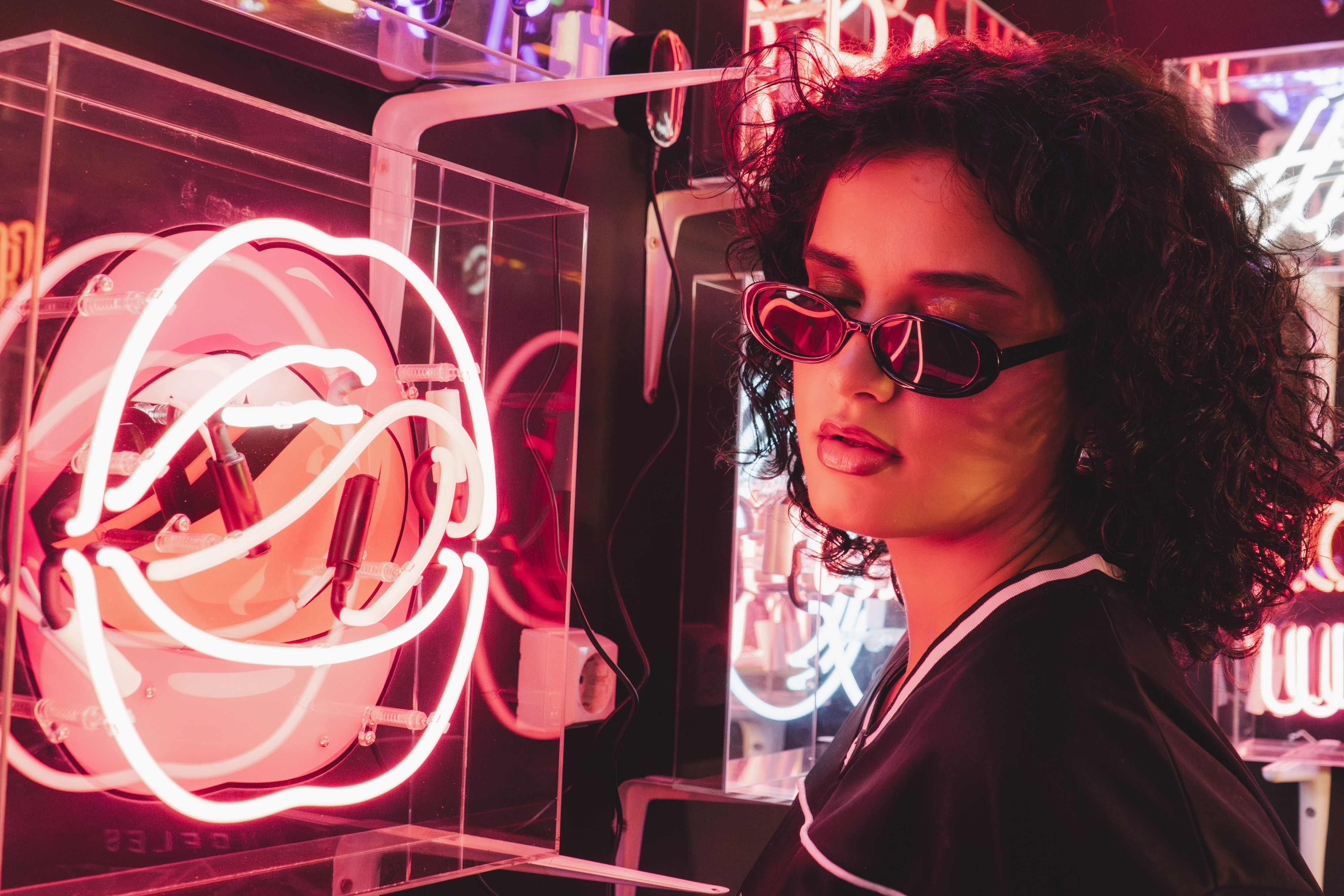 Brunette Woman in Red Neon Light · Free Stock Photo