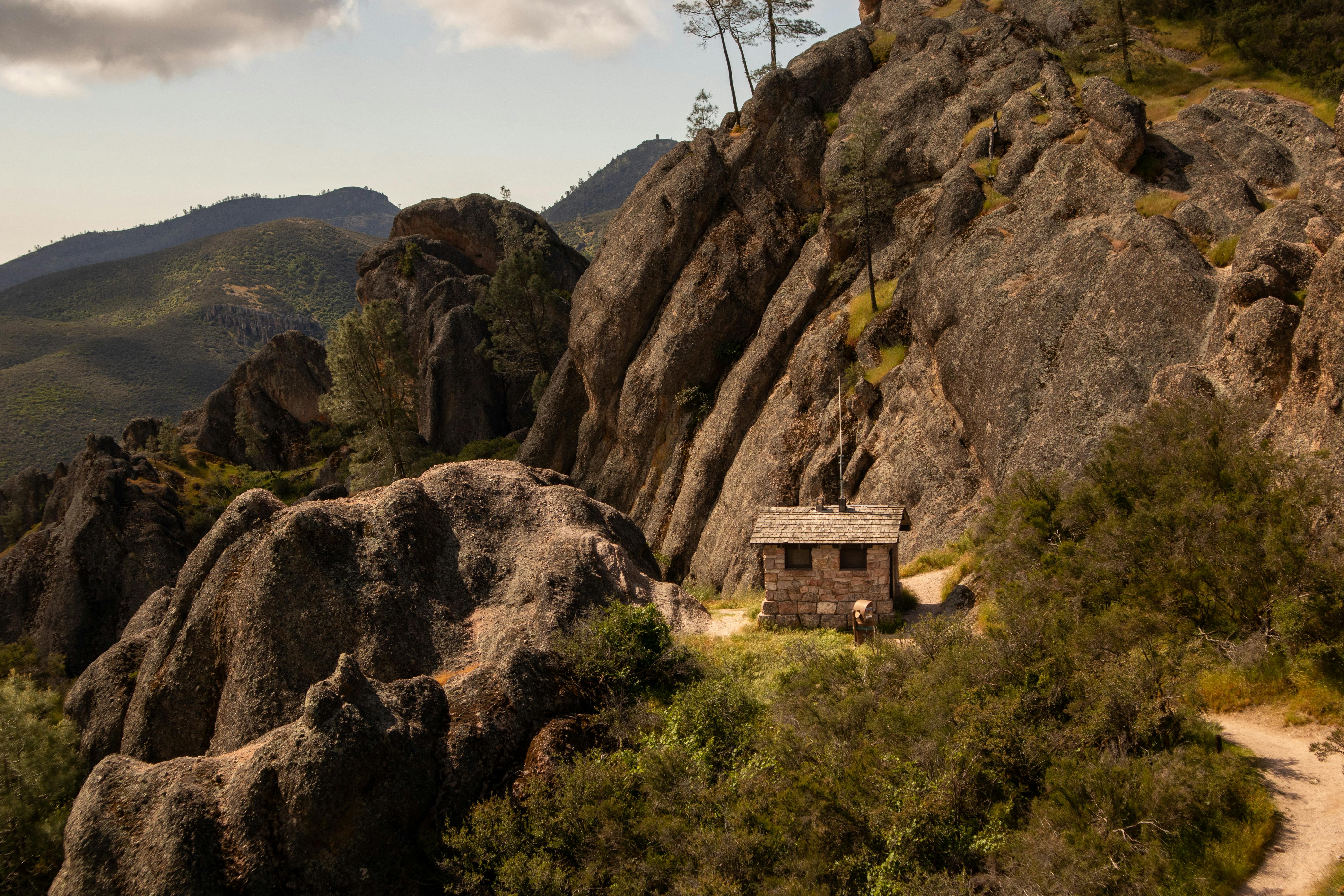 View of a Small Hut on a Trail in Rocky Mountains · Free Stock Photo