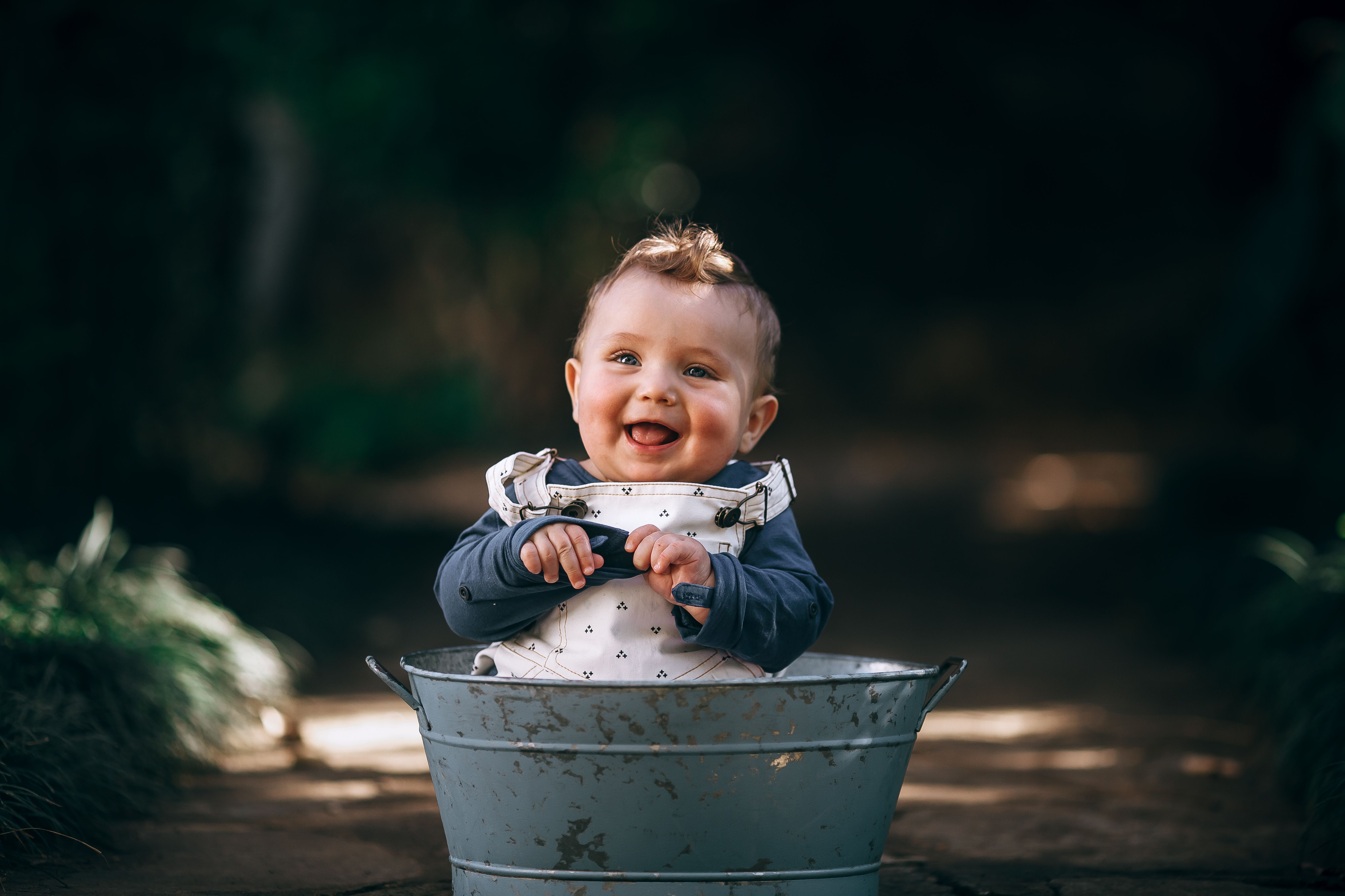 Girl Holding Bucket on Seashore · Free Stock Photo