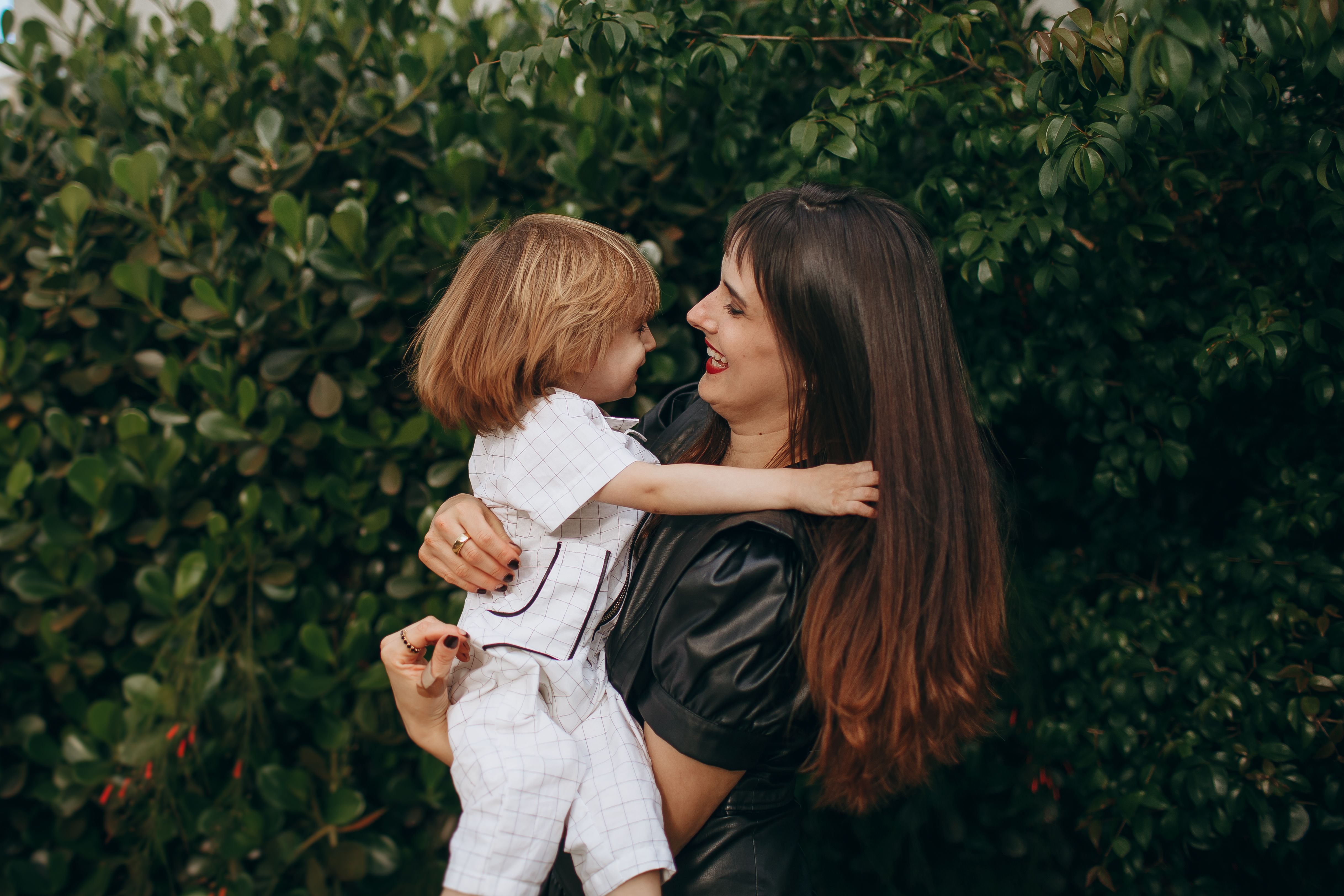 Mother and Child in a Joyful Outdoor Embrace · Free Stock Photo