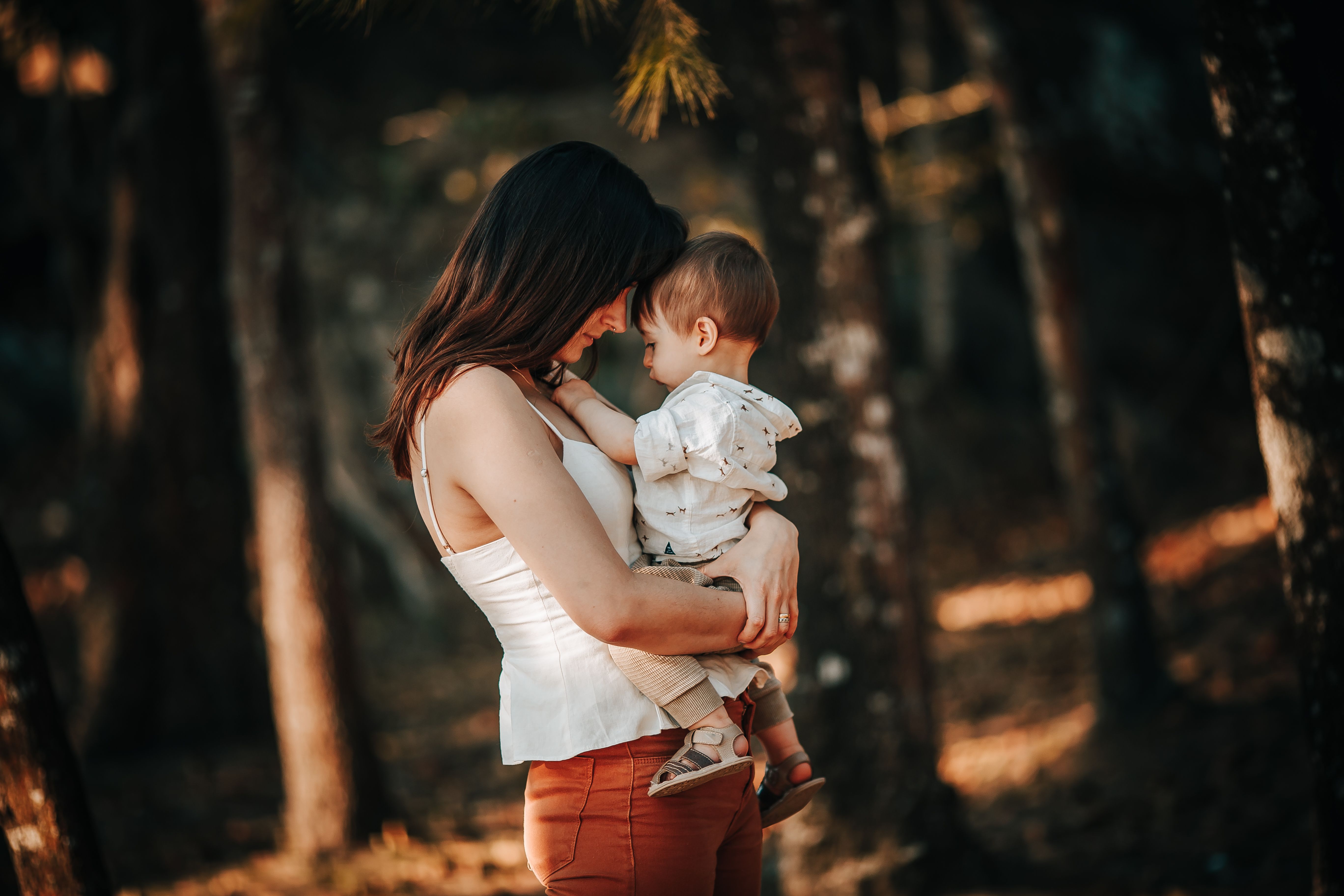 Woman Standing with Child in Forest · Free Stock Photo