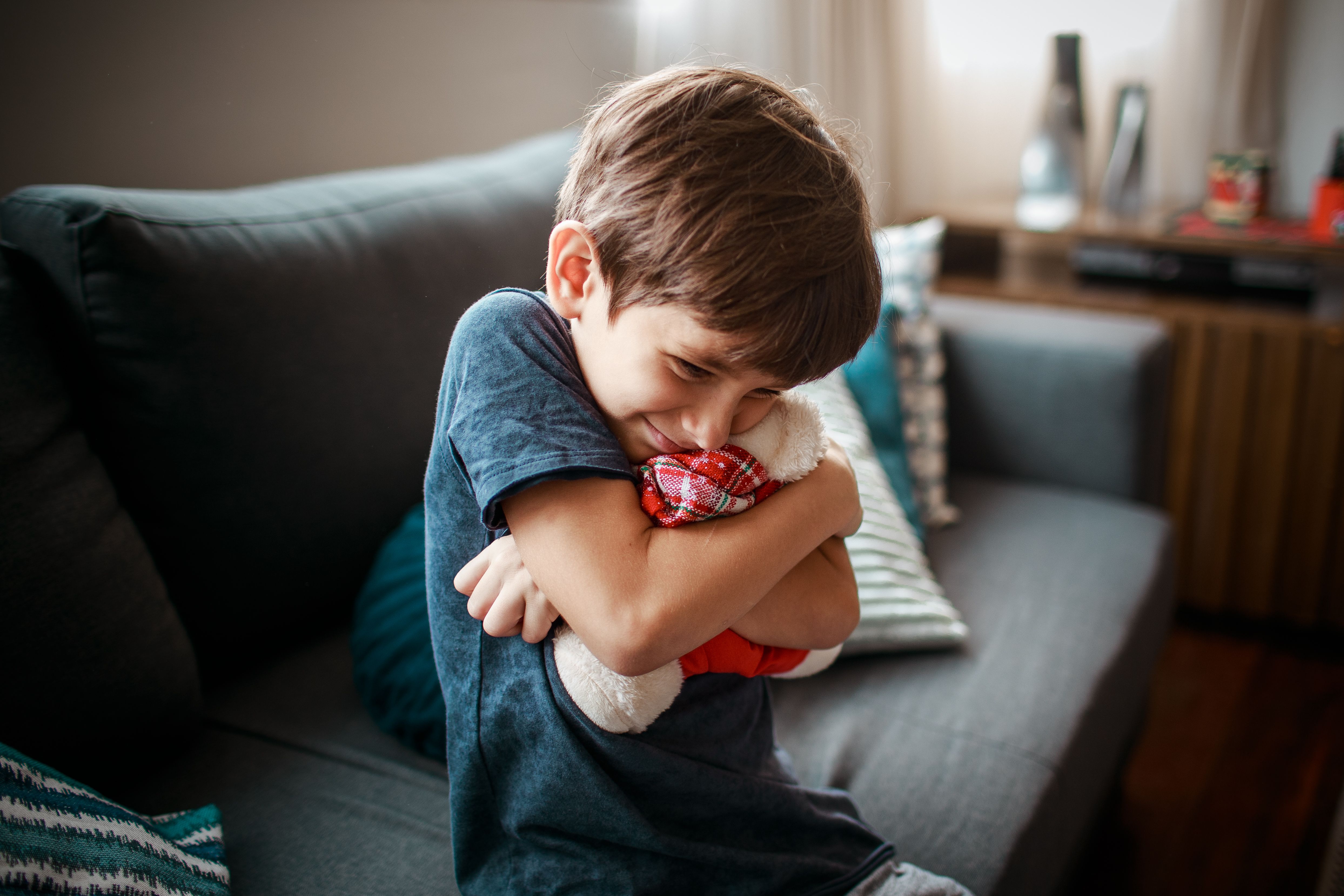 Smiling Boy Hugging Toy · Free Stock Photo