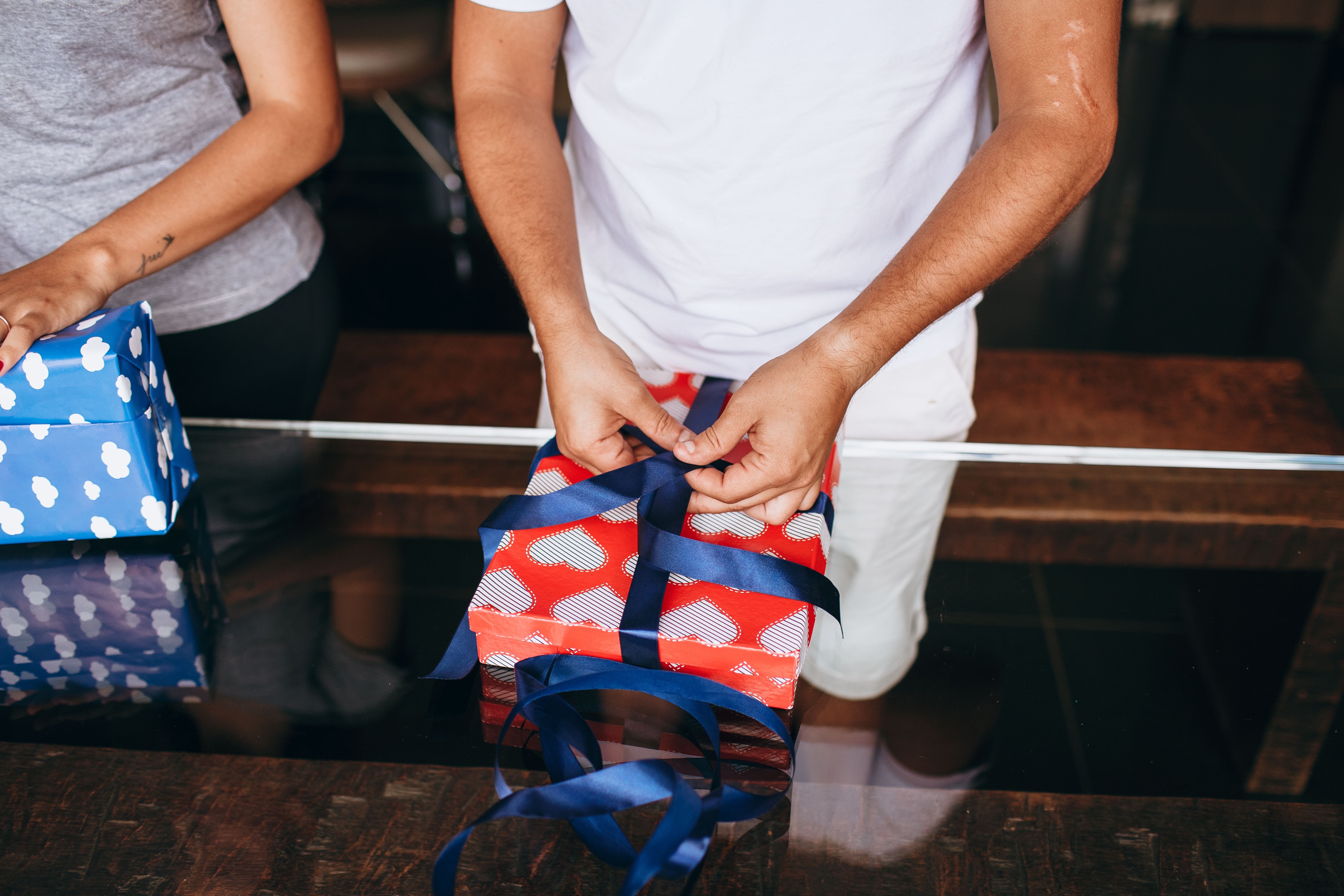Person Preparing a Gift Box · Free Stock Photo