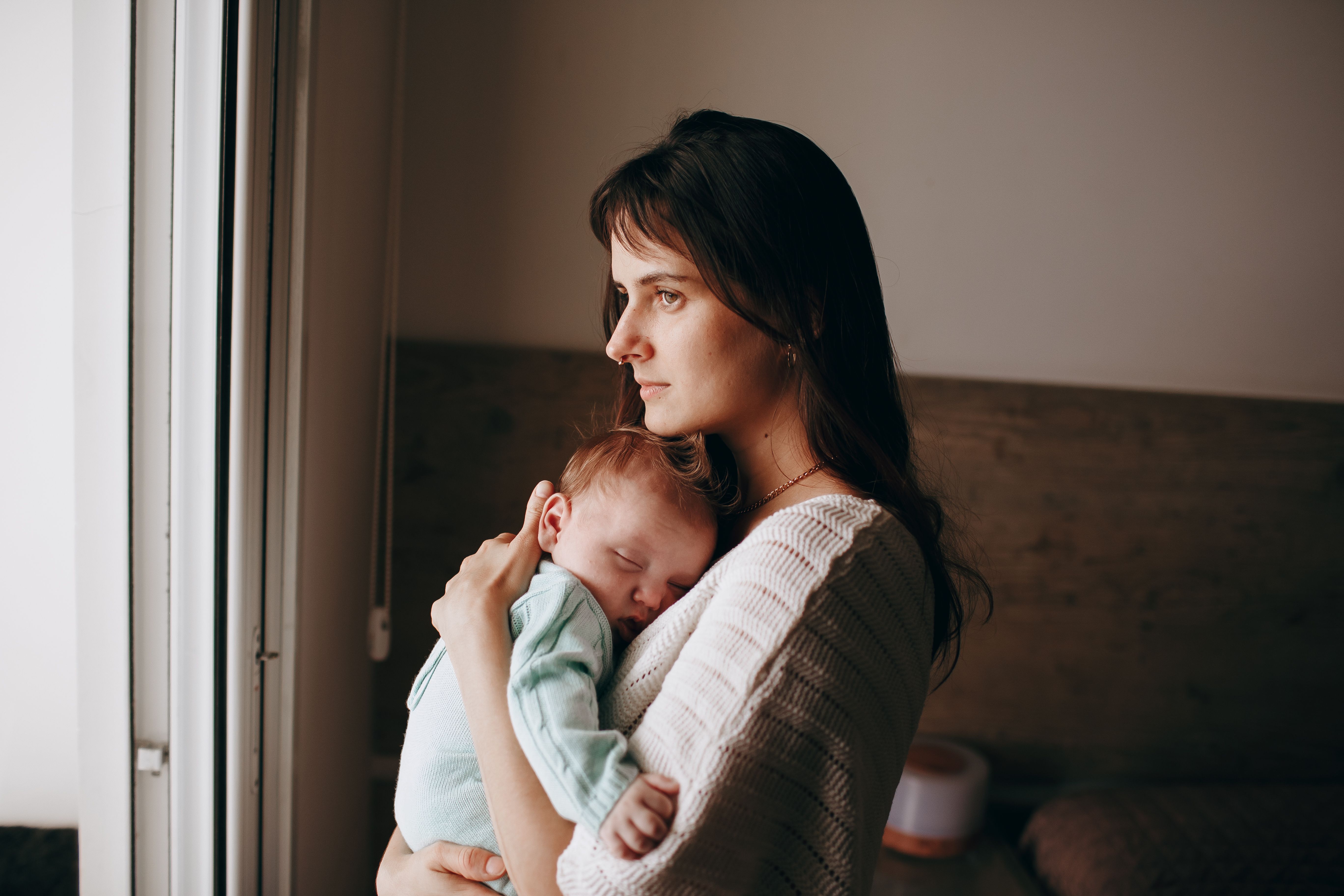 Mother Standing and Hugging Newborn · Free Stock Photo