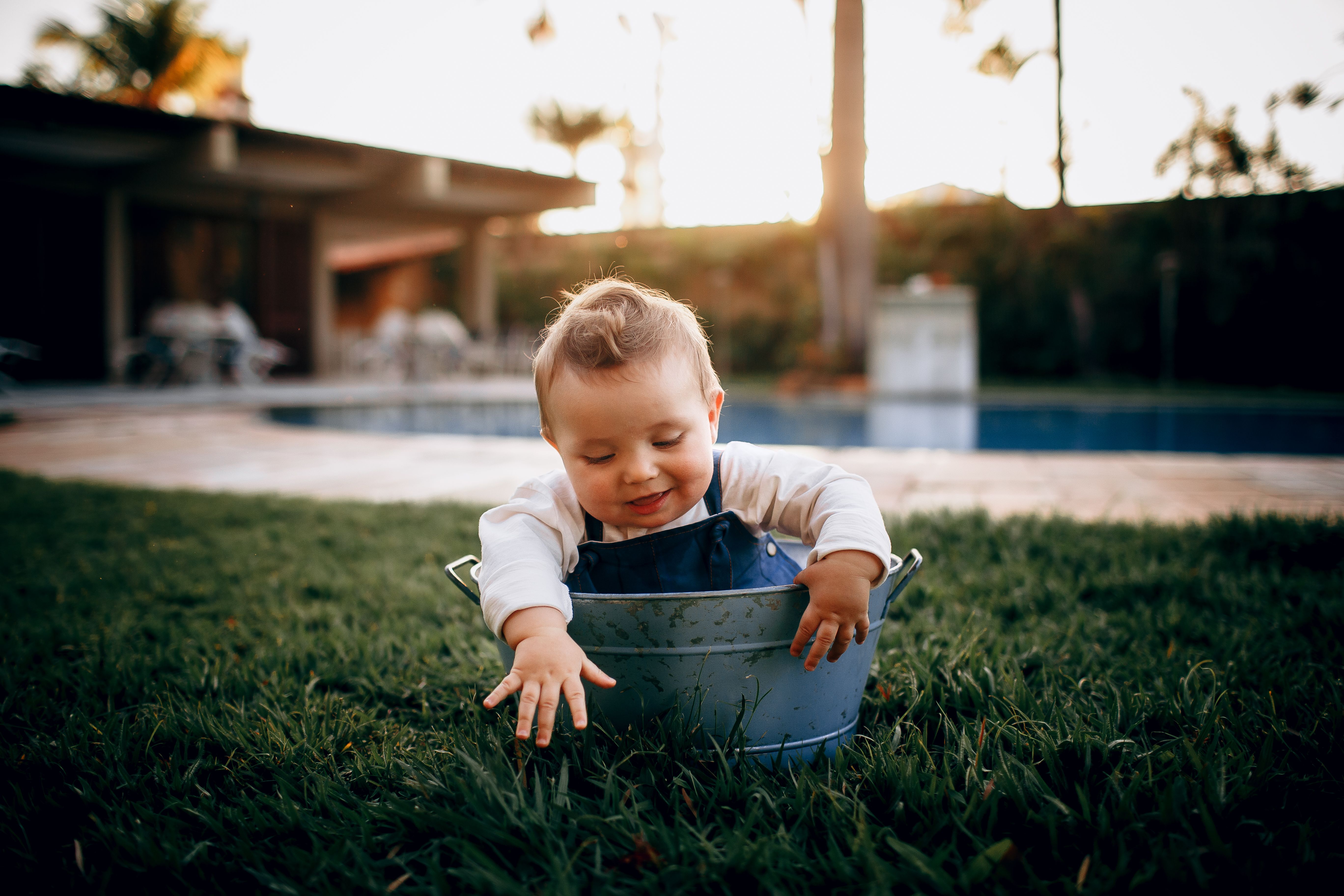 Smiling Boy in a Bucket · Free Stock Photo