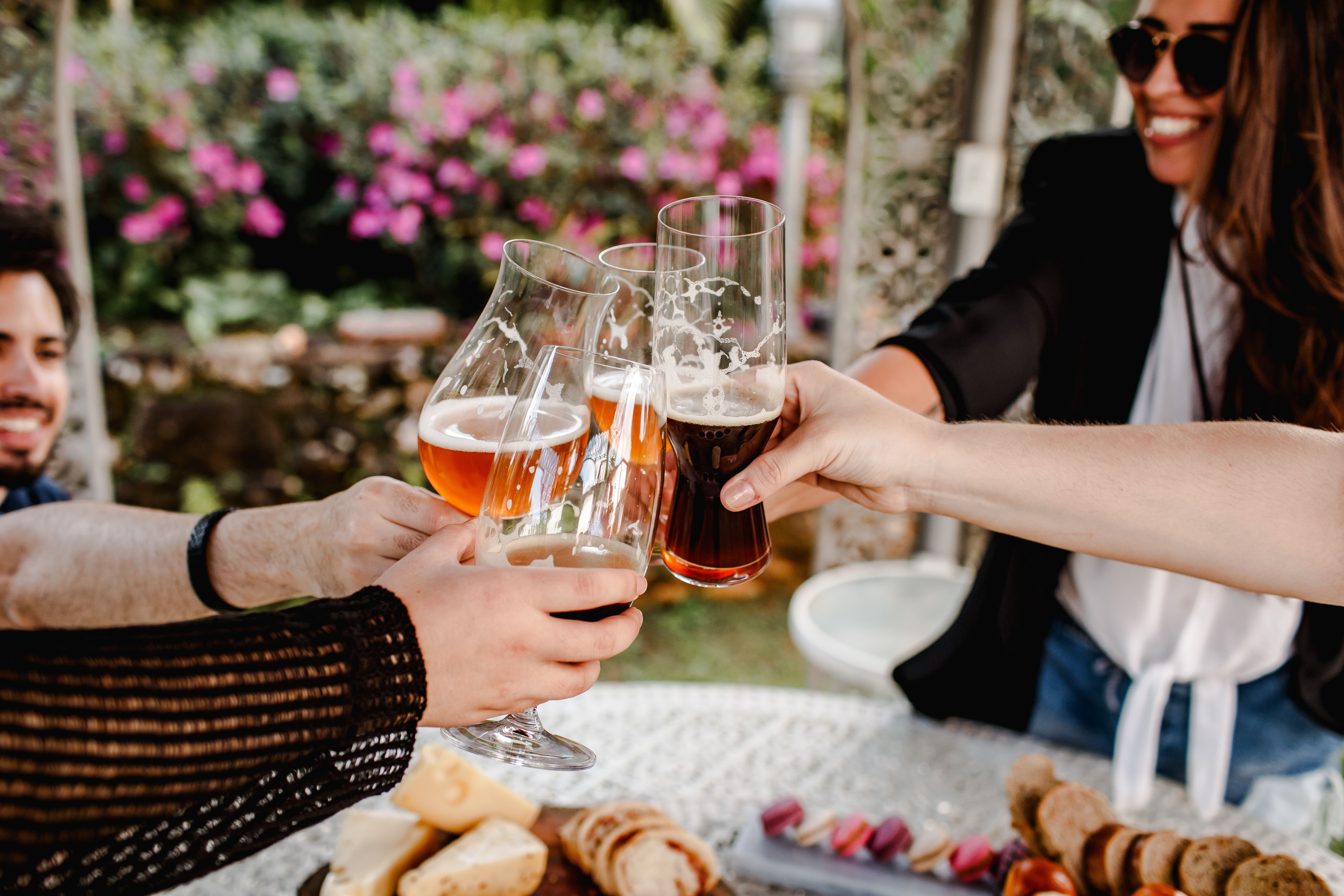 Smiling Friends with Alcohol Glasses · Free Stock Photo