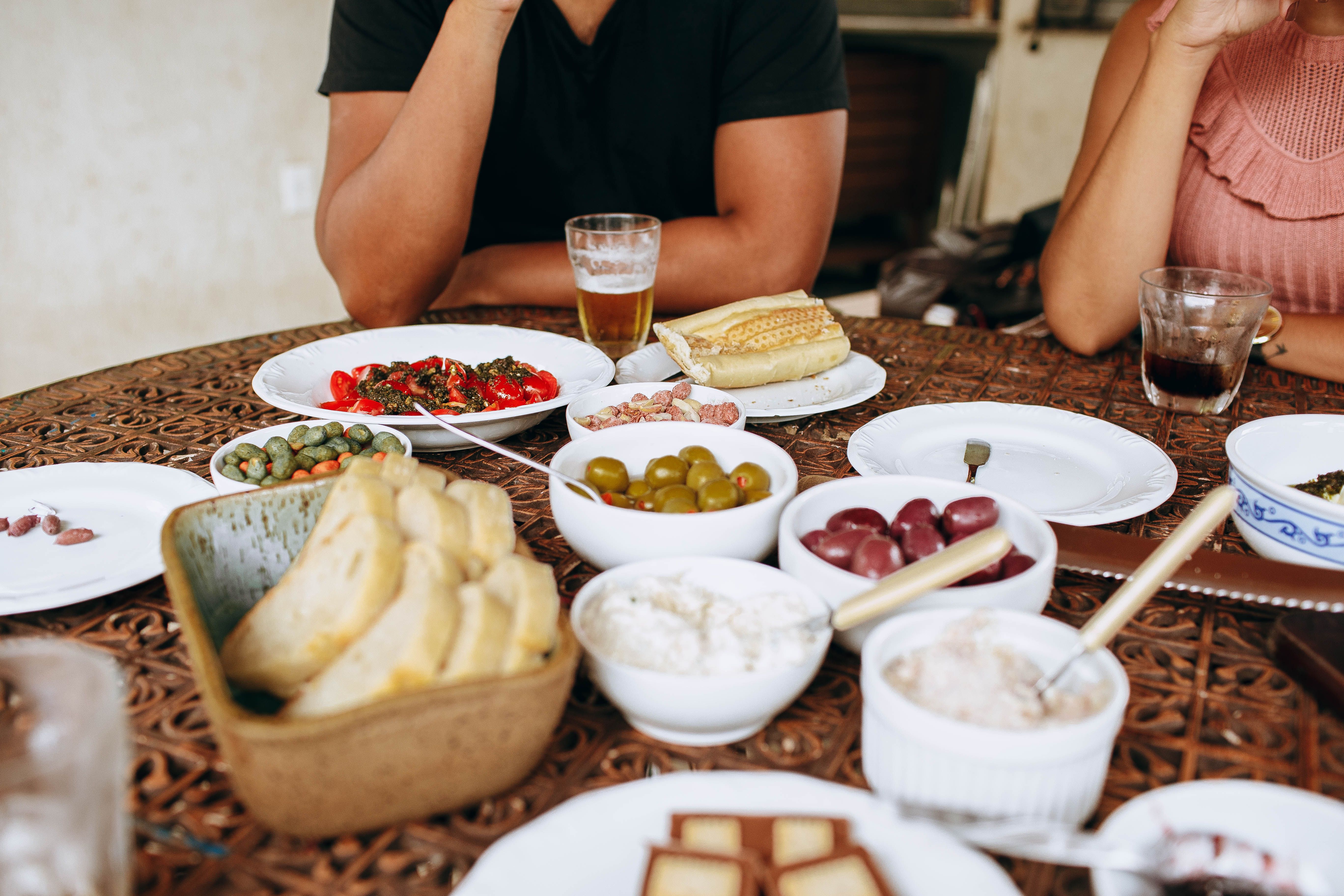 People Eating Appetizers on Terrace · Free Stock Photo