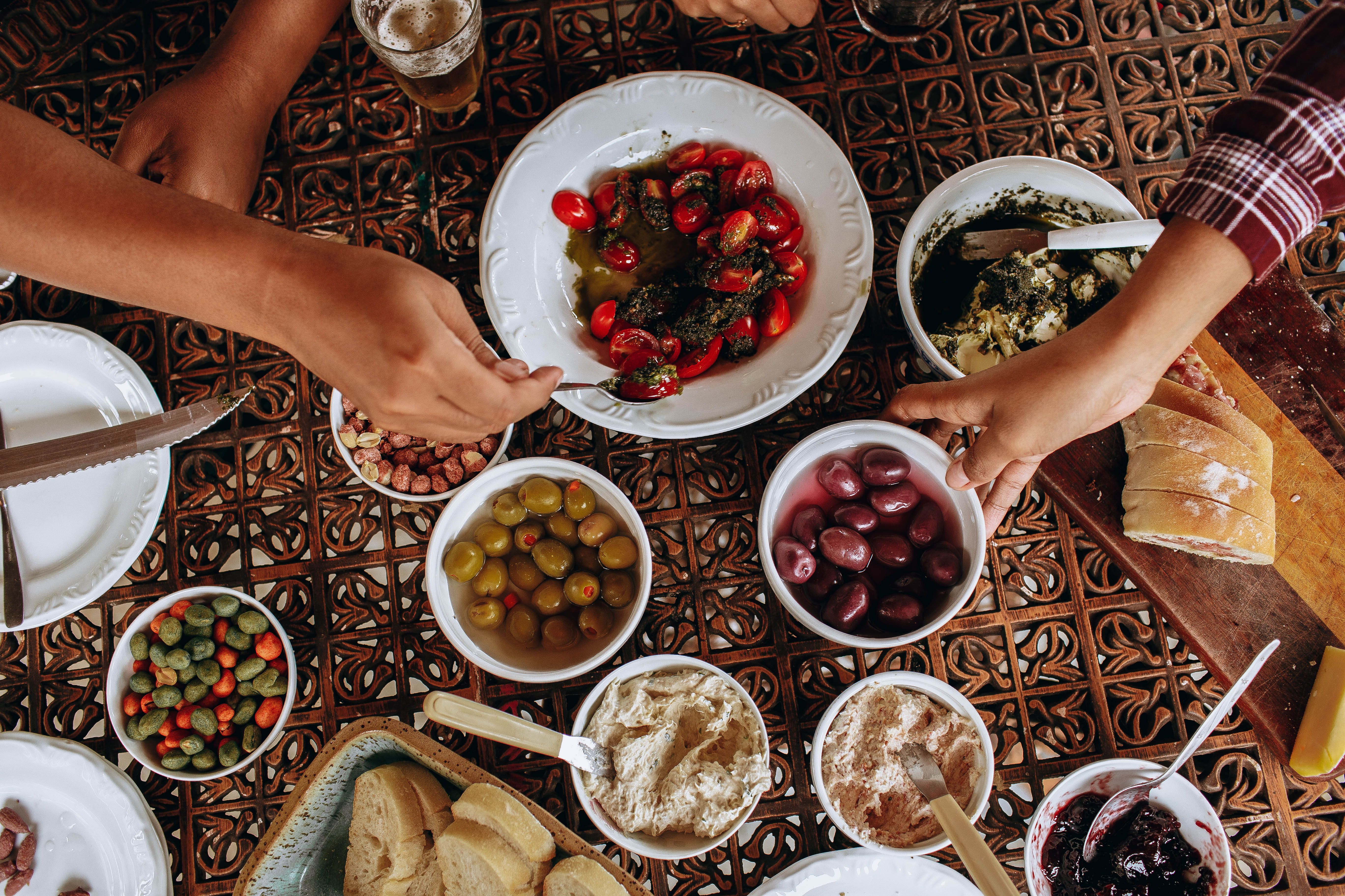 People Eating Appetizers in a Restaurant · Free Stock Photo