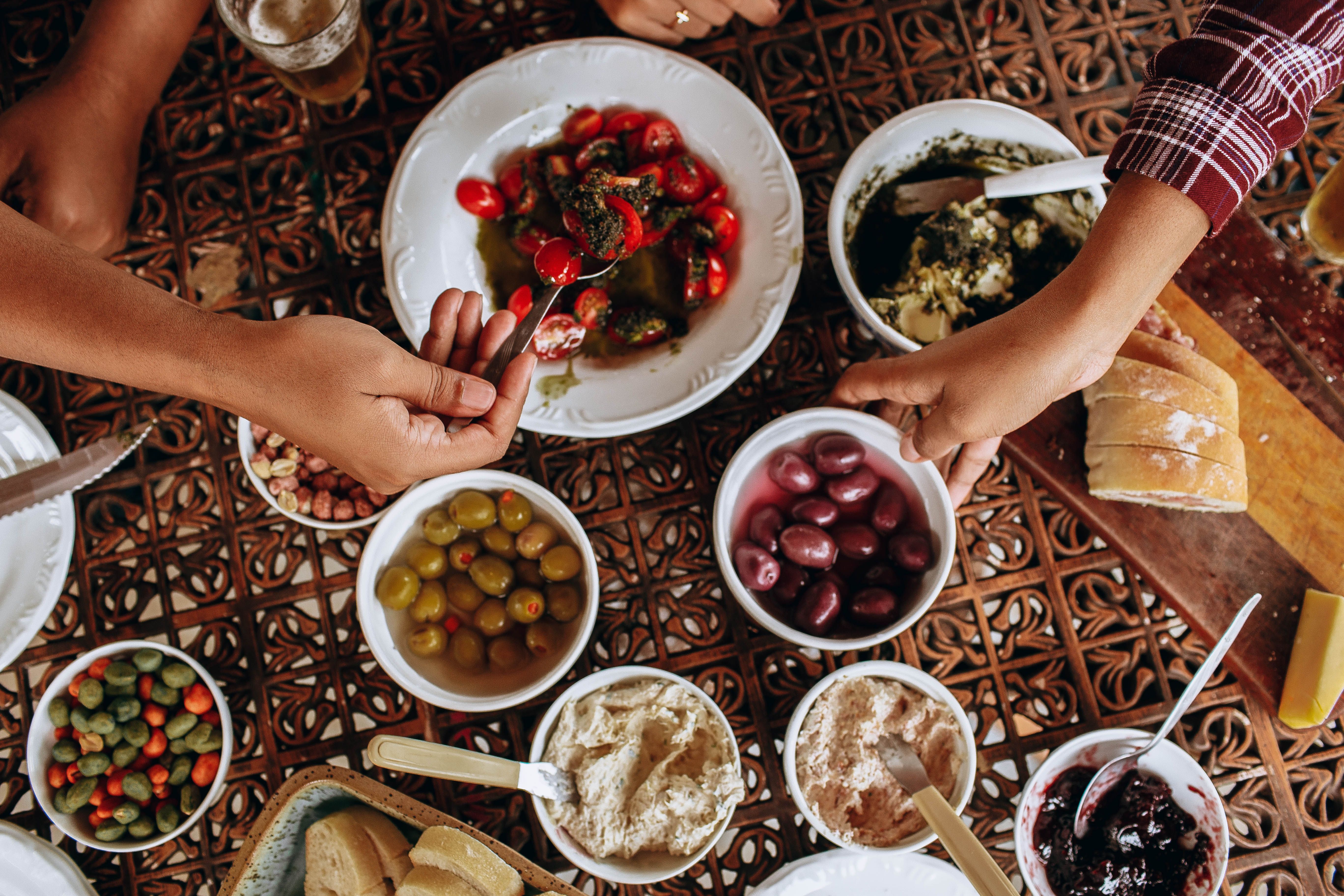 People Eating Appetizers in a Restaurant · Free Stock Photo