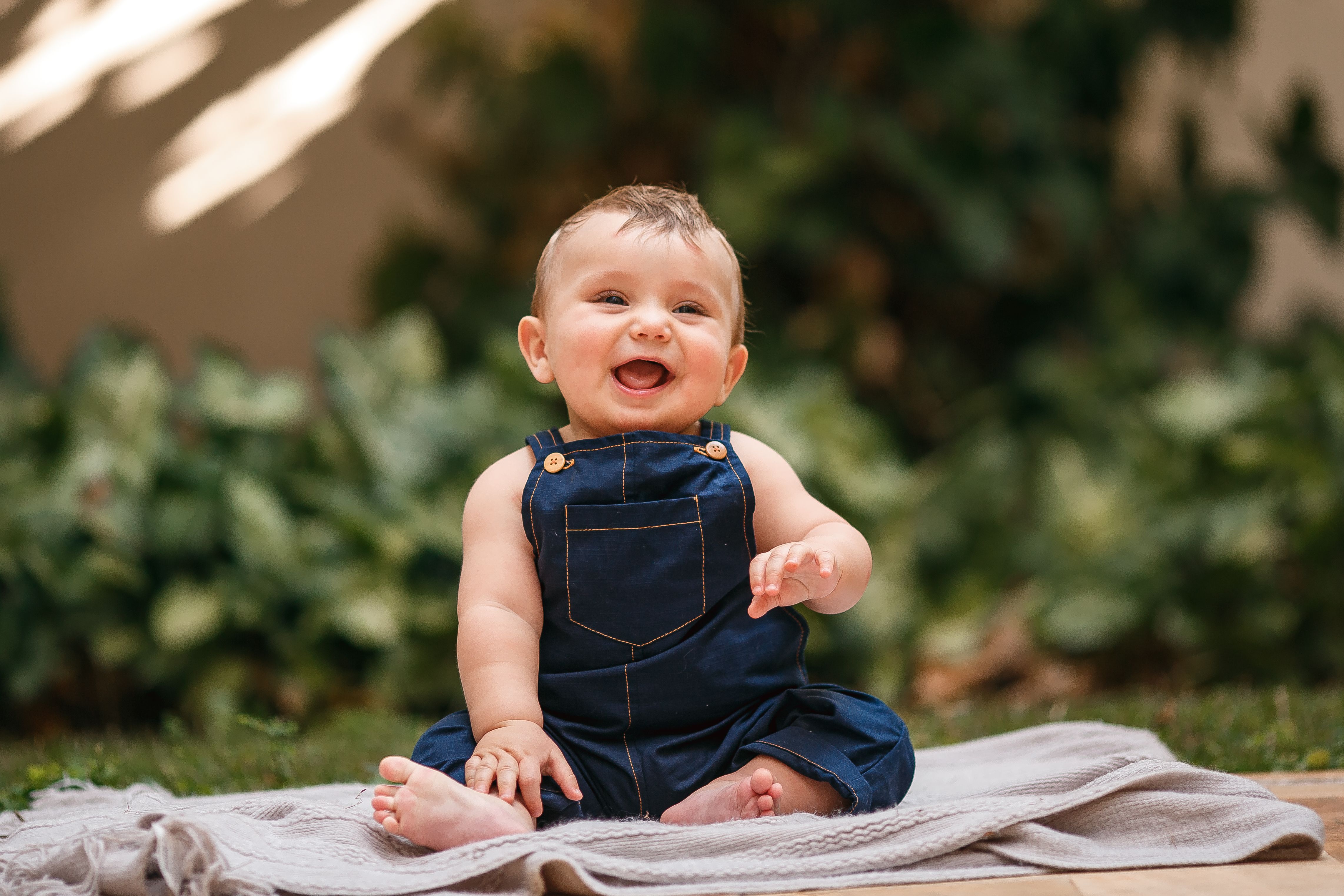 Laughing Baby in Jean Overalls · Free Stock Photo