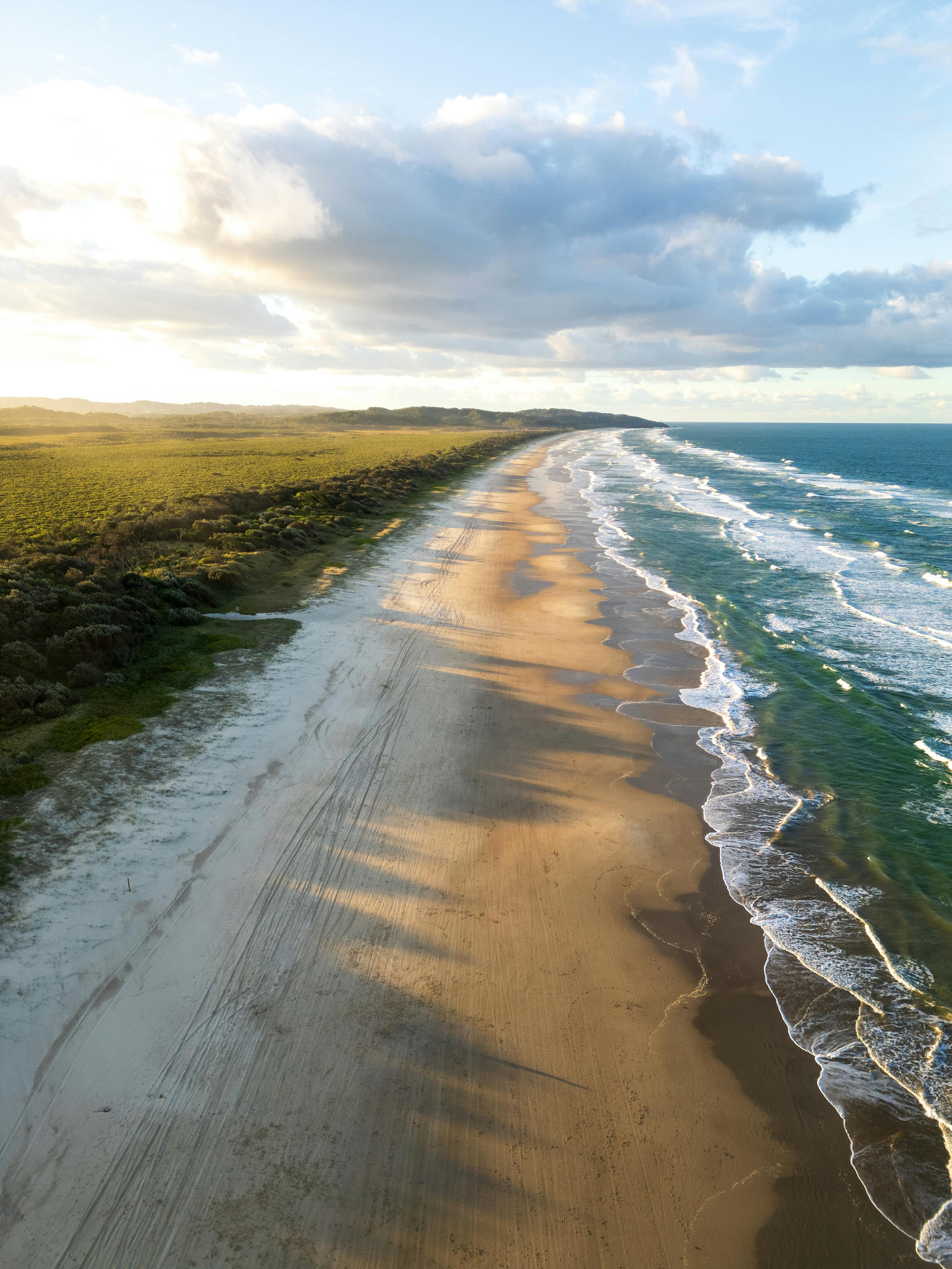 Birds Eye View of Beach on Sea Coast · Free Stock Photo