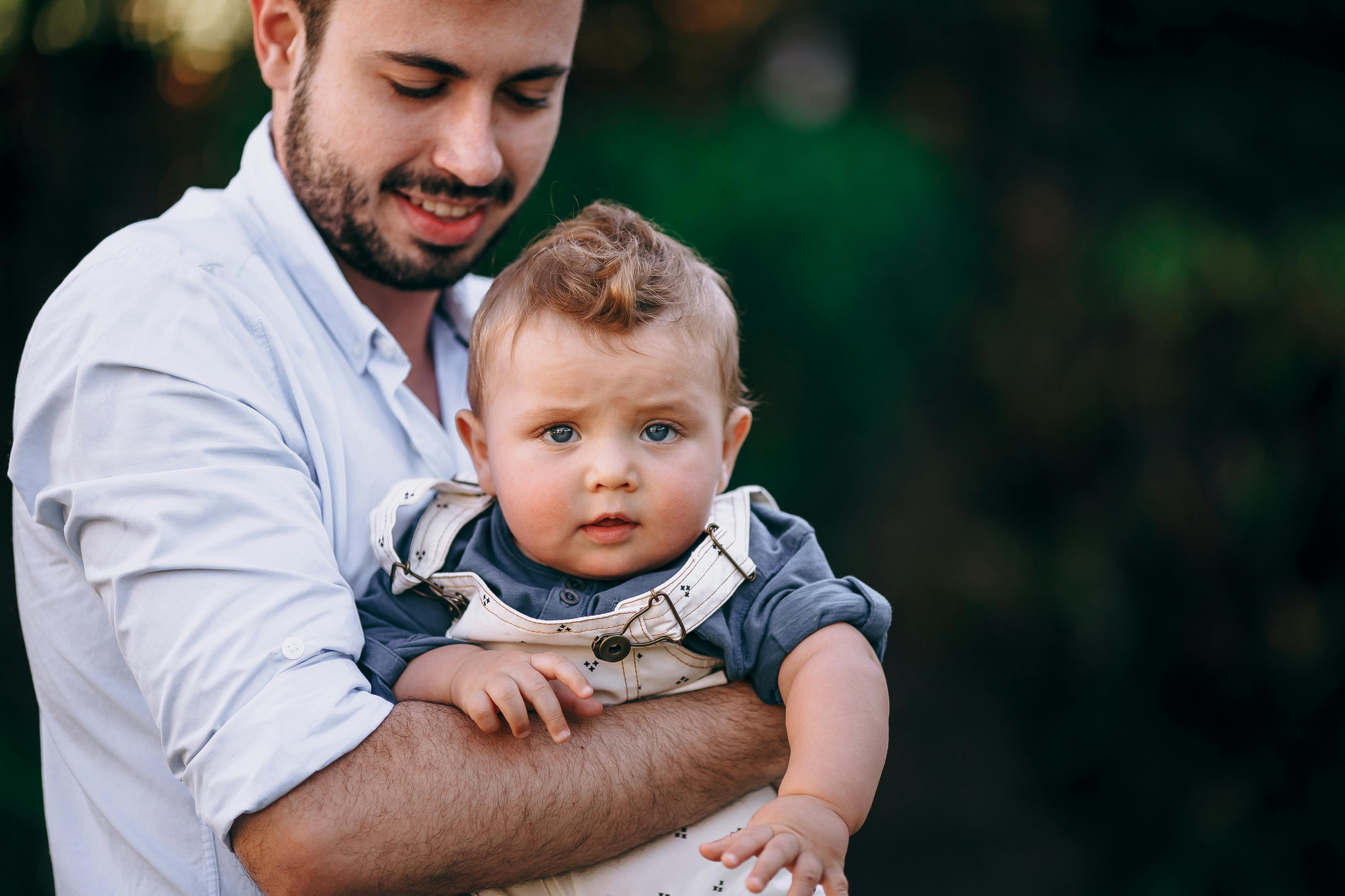 Man Carrying His Baby · Free Stock Photo