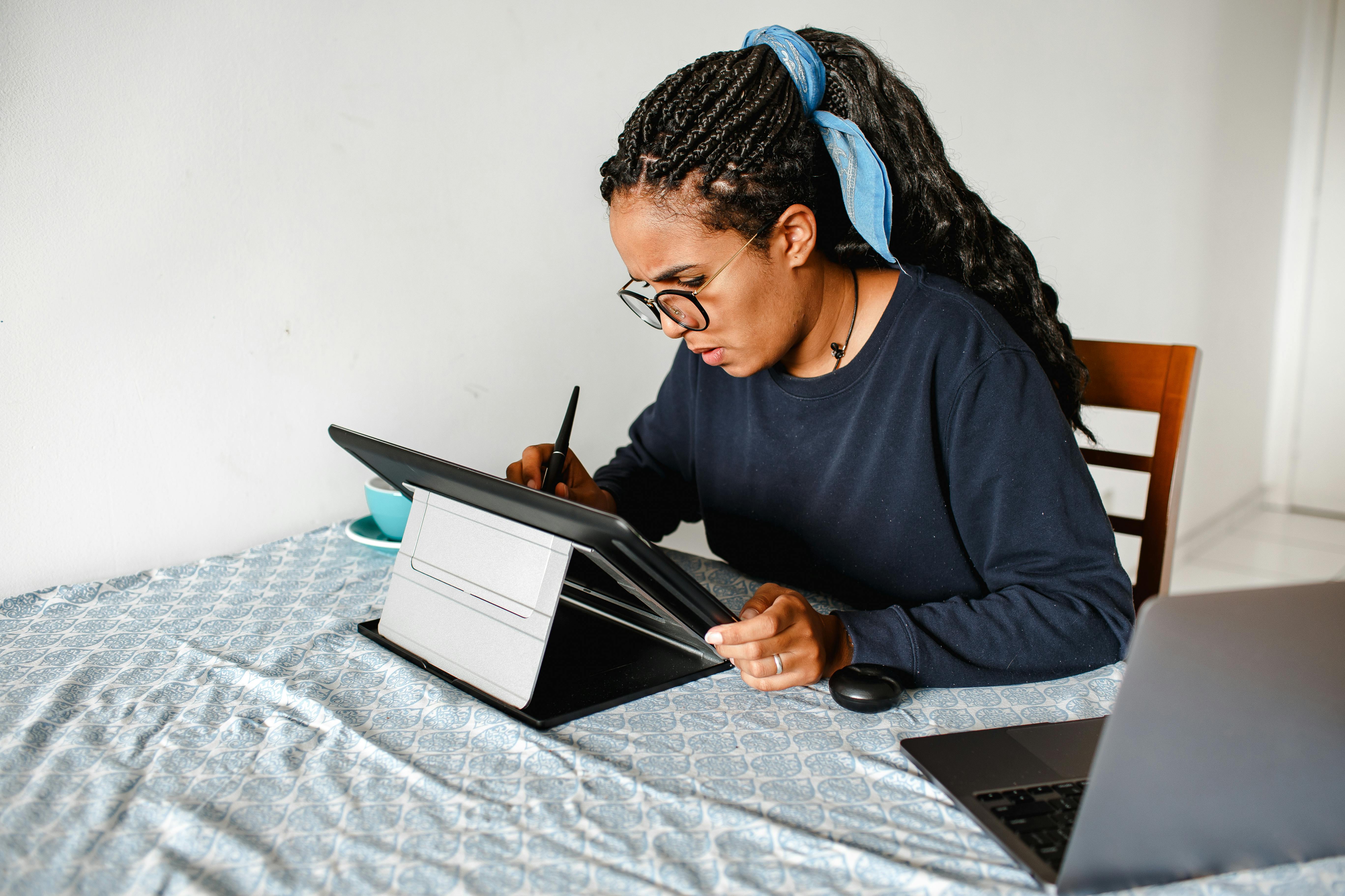 Person Drawing on a Tablet · Free Stock Photo