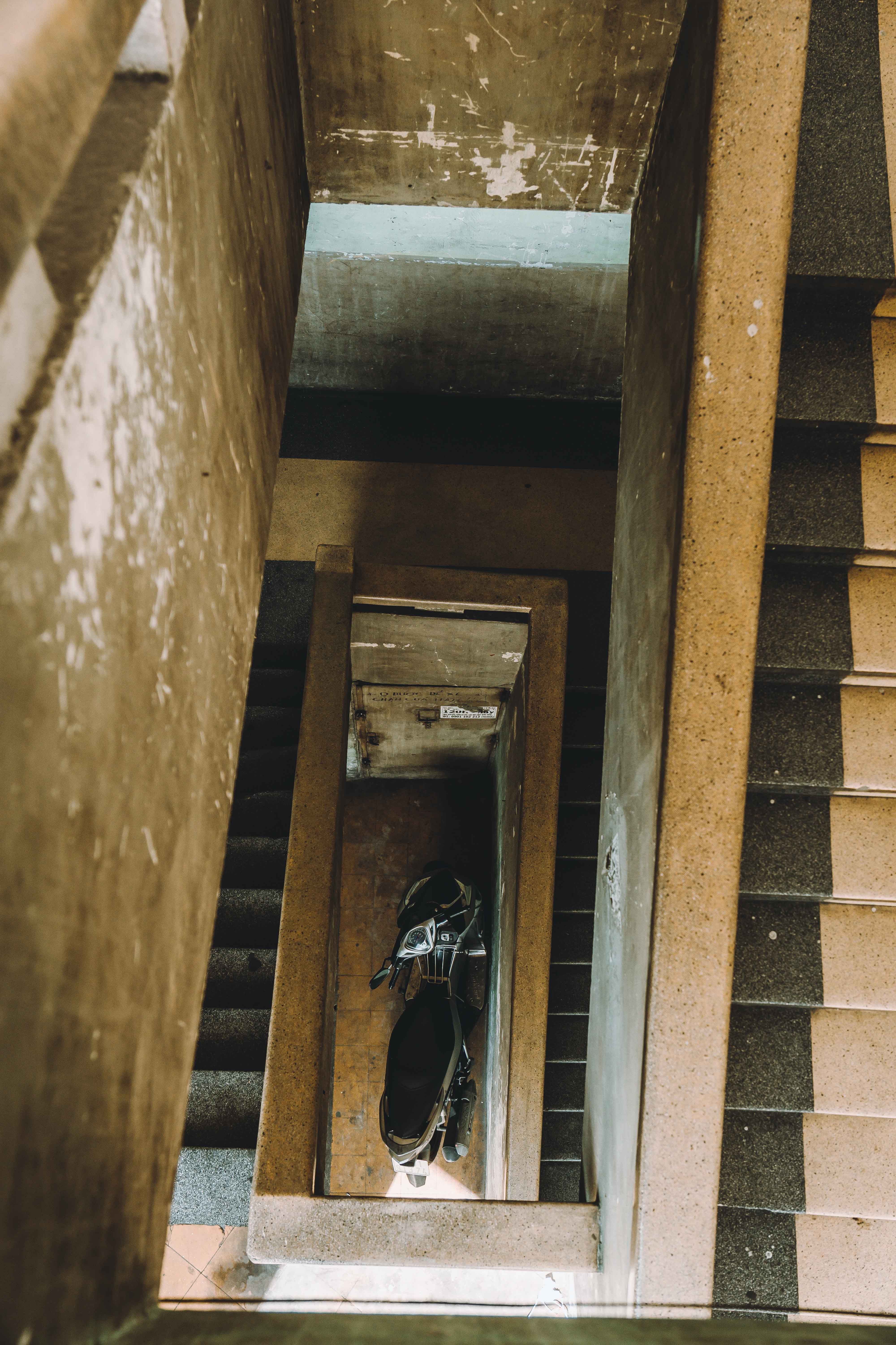 Motorcycle at Bottom of Staircase in Building · Free Stock Photo