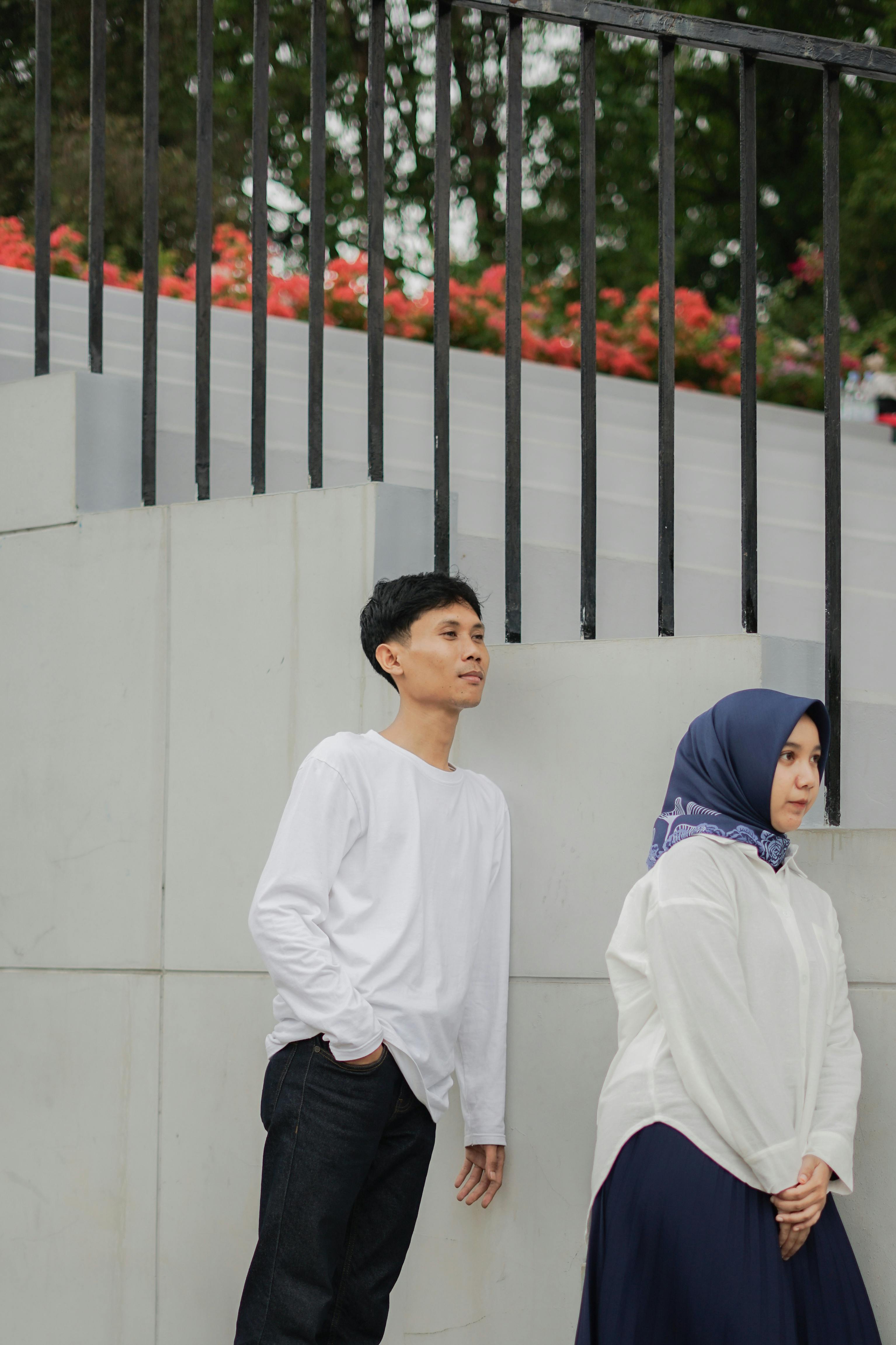 Man Standing Behind Woman by Stairs · Free Stock Photo