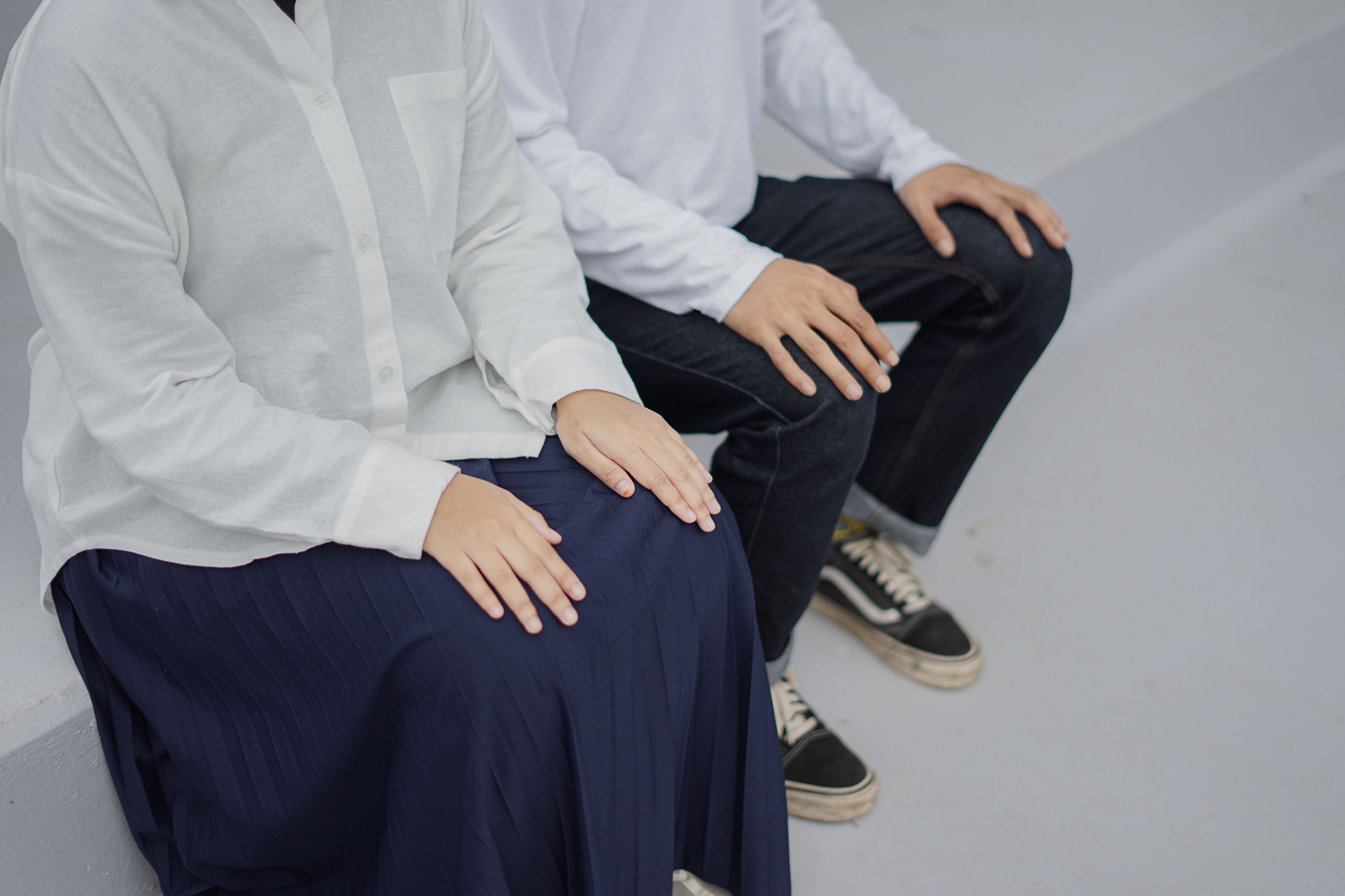 Hands of Sitting Woman and Man · Free Stock Photo