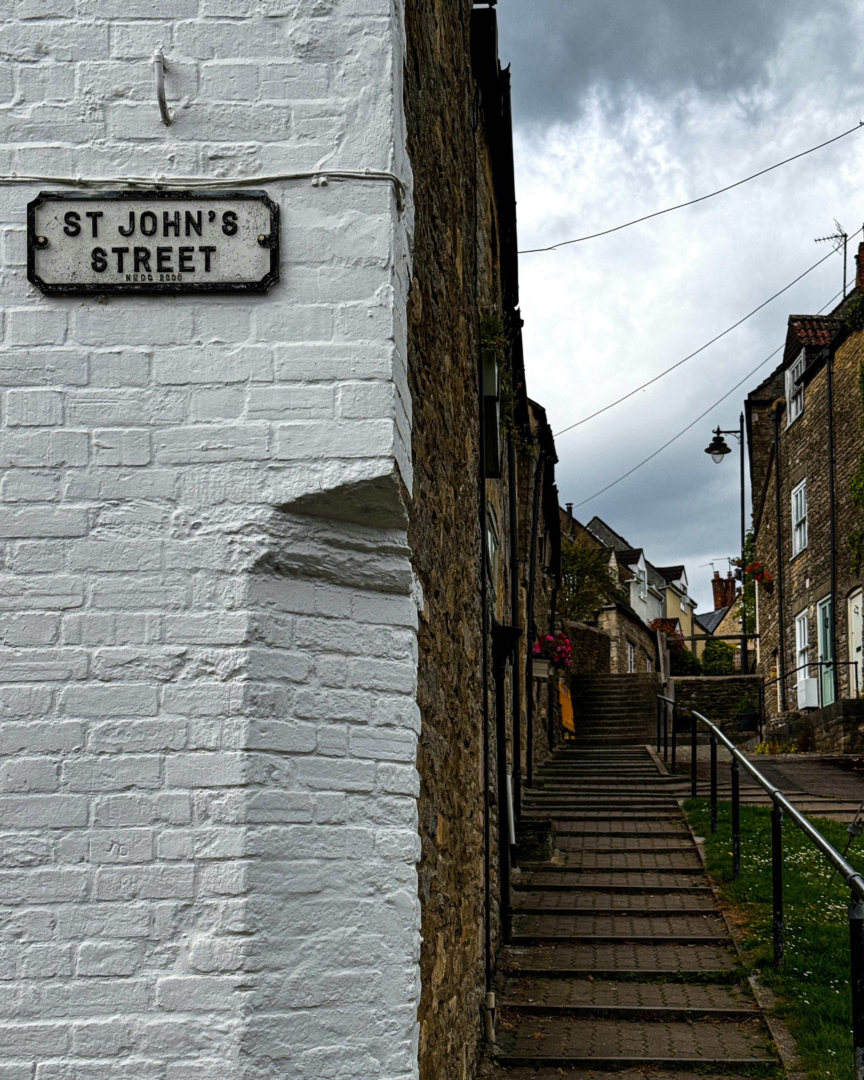 View of a Narrow Walkway between the Houses in a City · Free Stock Photo