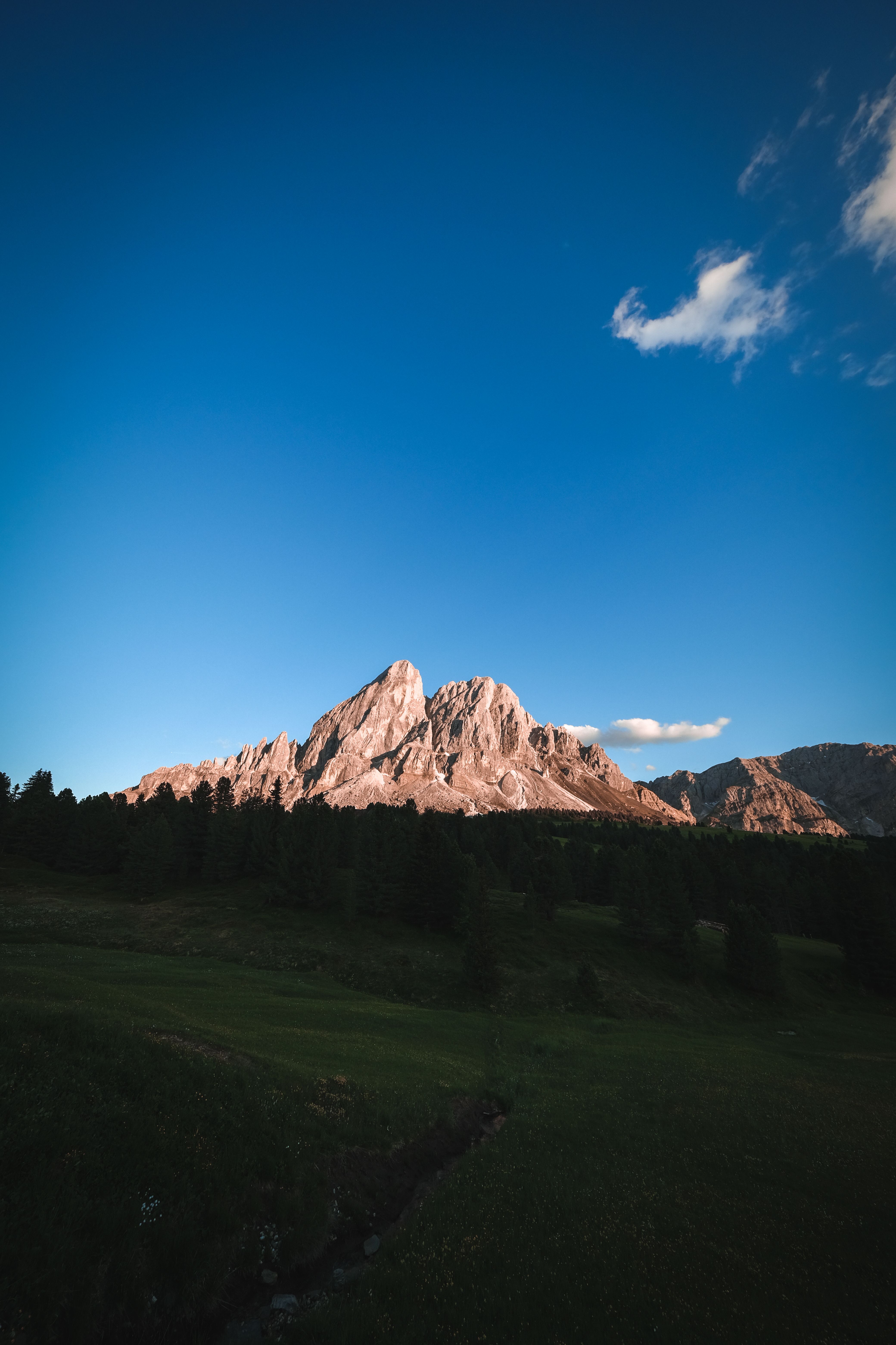 Rocky Mountain and Shadow on a Field · Free Stock Photo