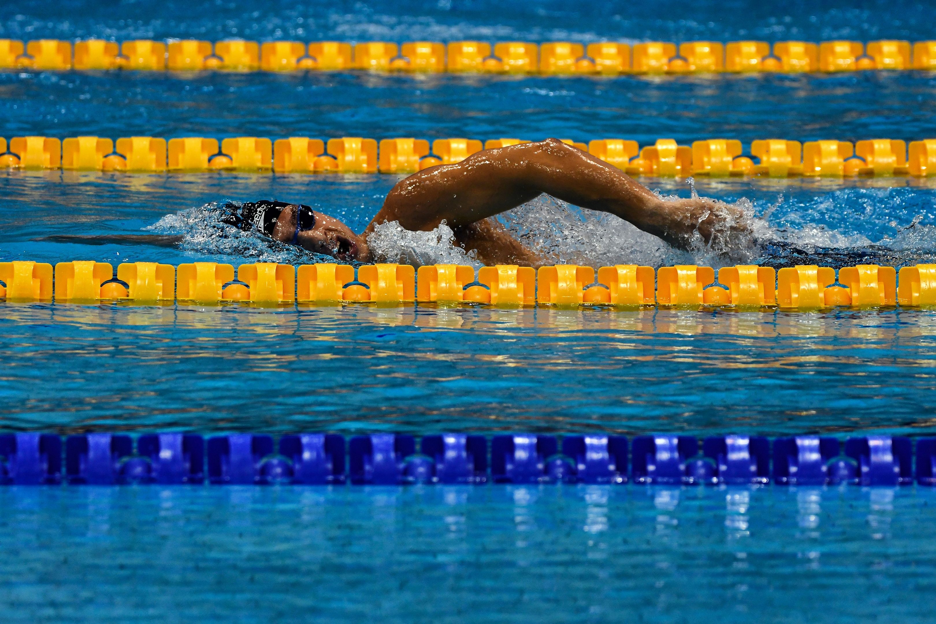 Breathe - The image catches a swimmer gasping out for air as he races ...