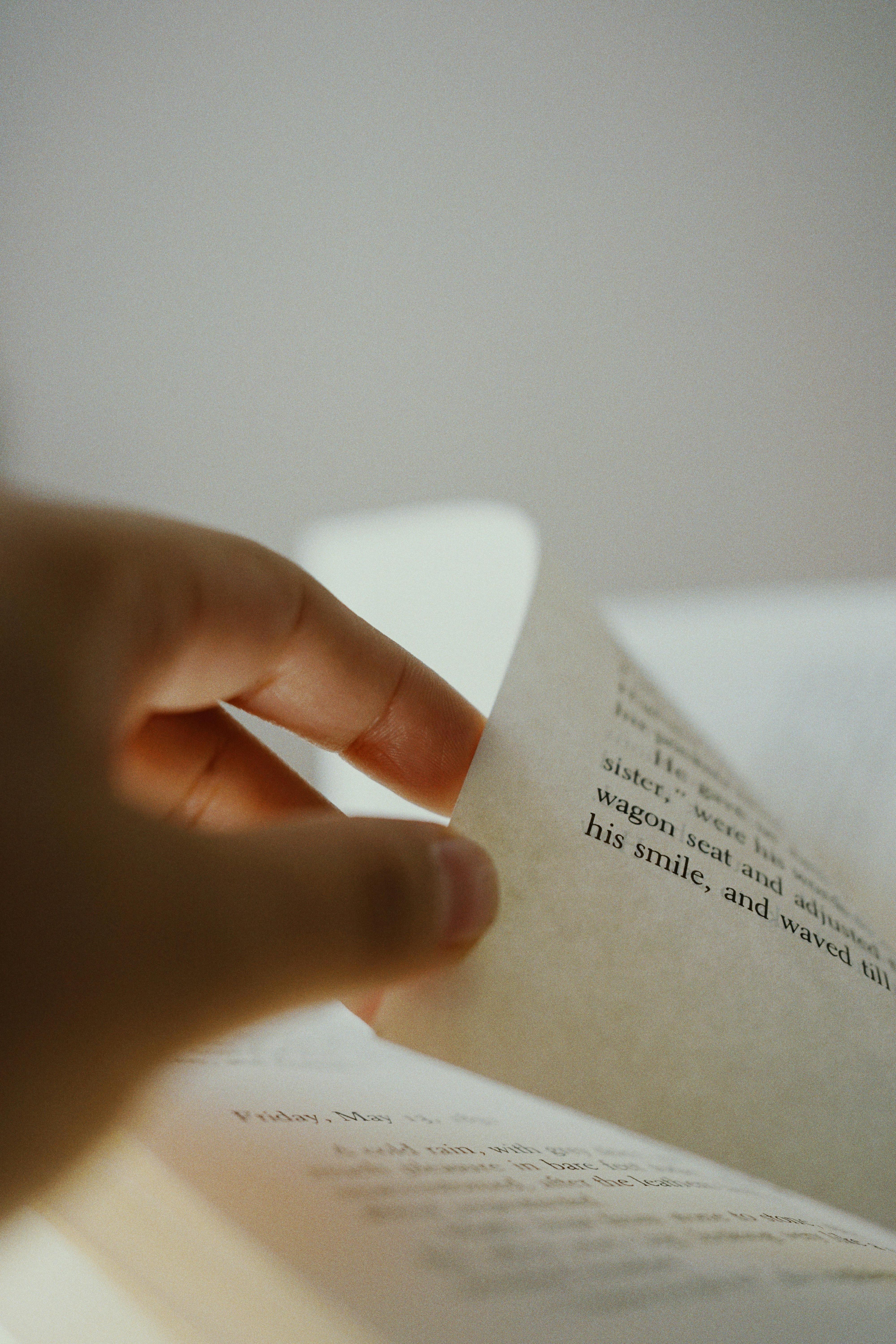 Hand Holding Page of Book · Free Stock Photo