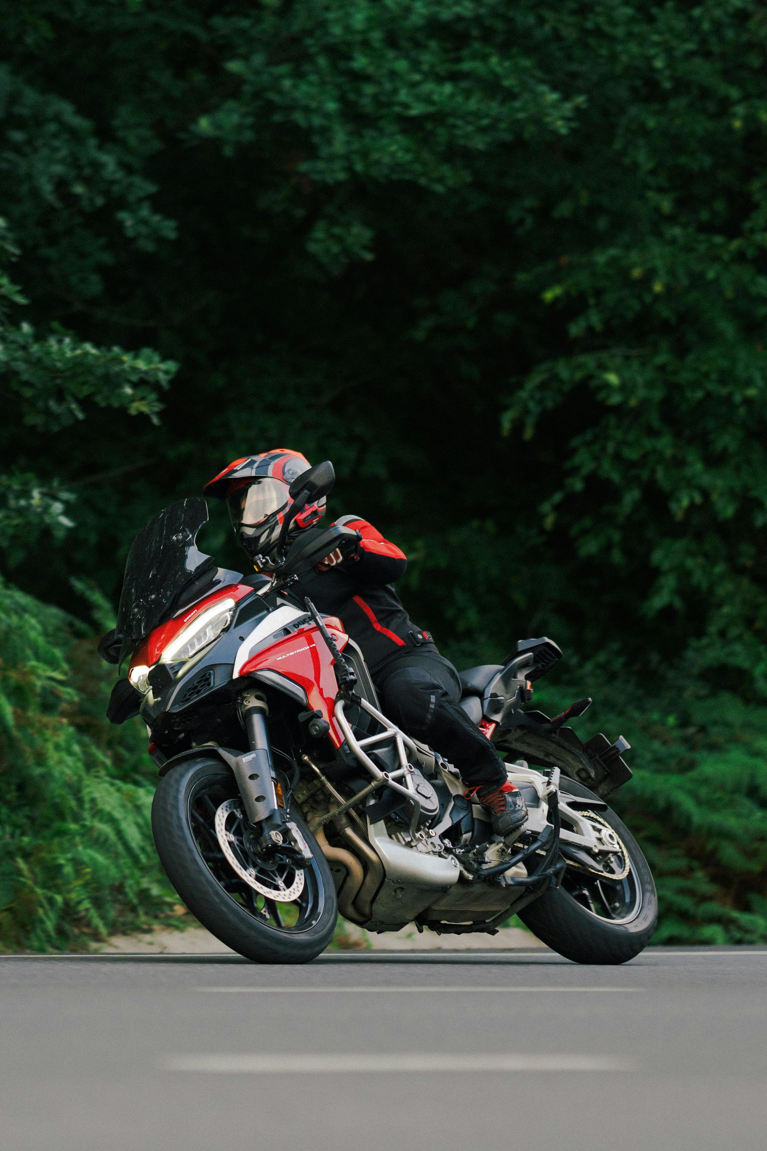 Photo of a Motorcyclist Riding a Ducati Multistrada Motorcycle · Free ...