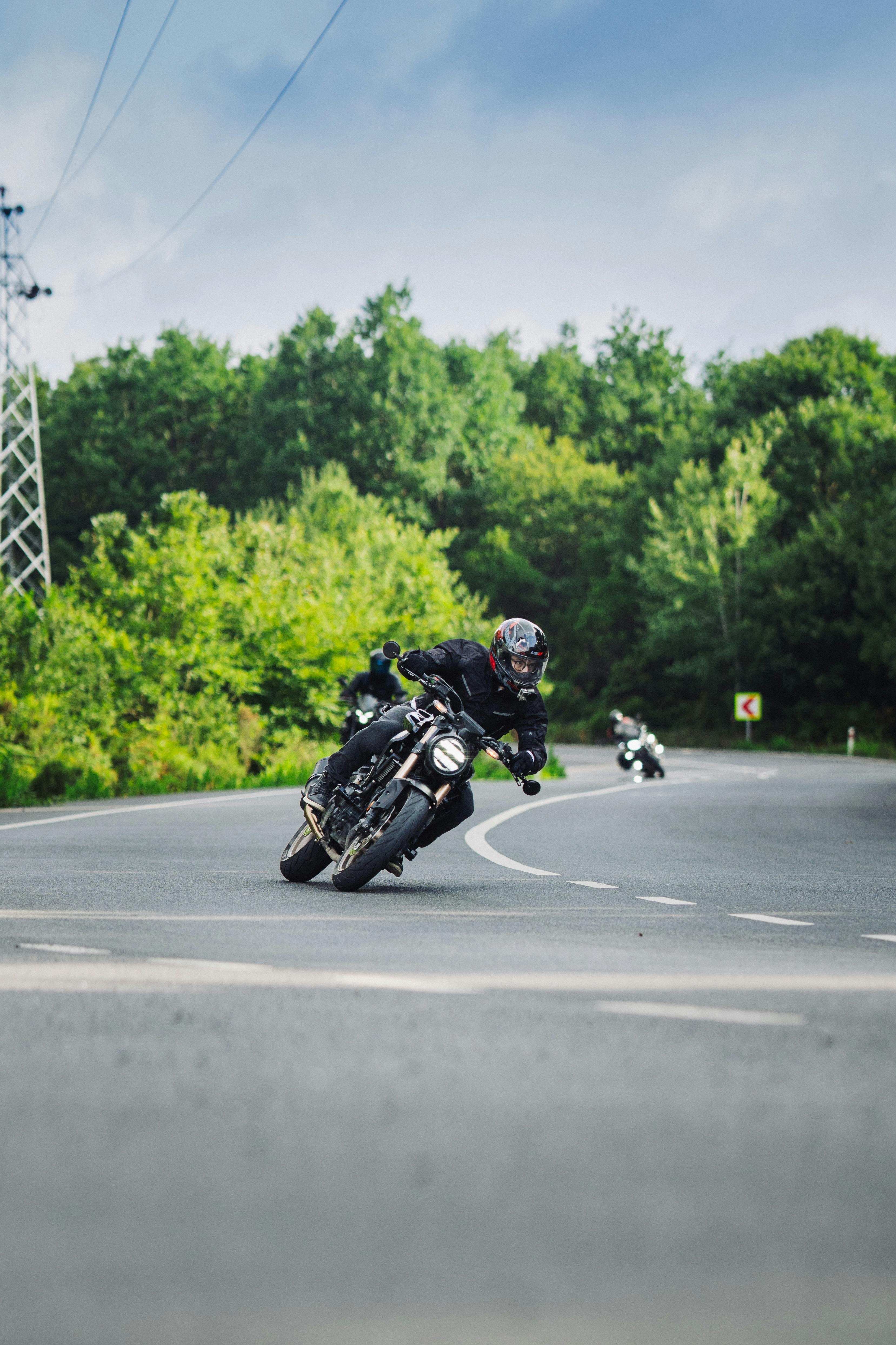 Man Riding Motorcycle on Road · Free Stock Photo