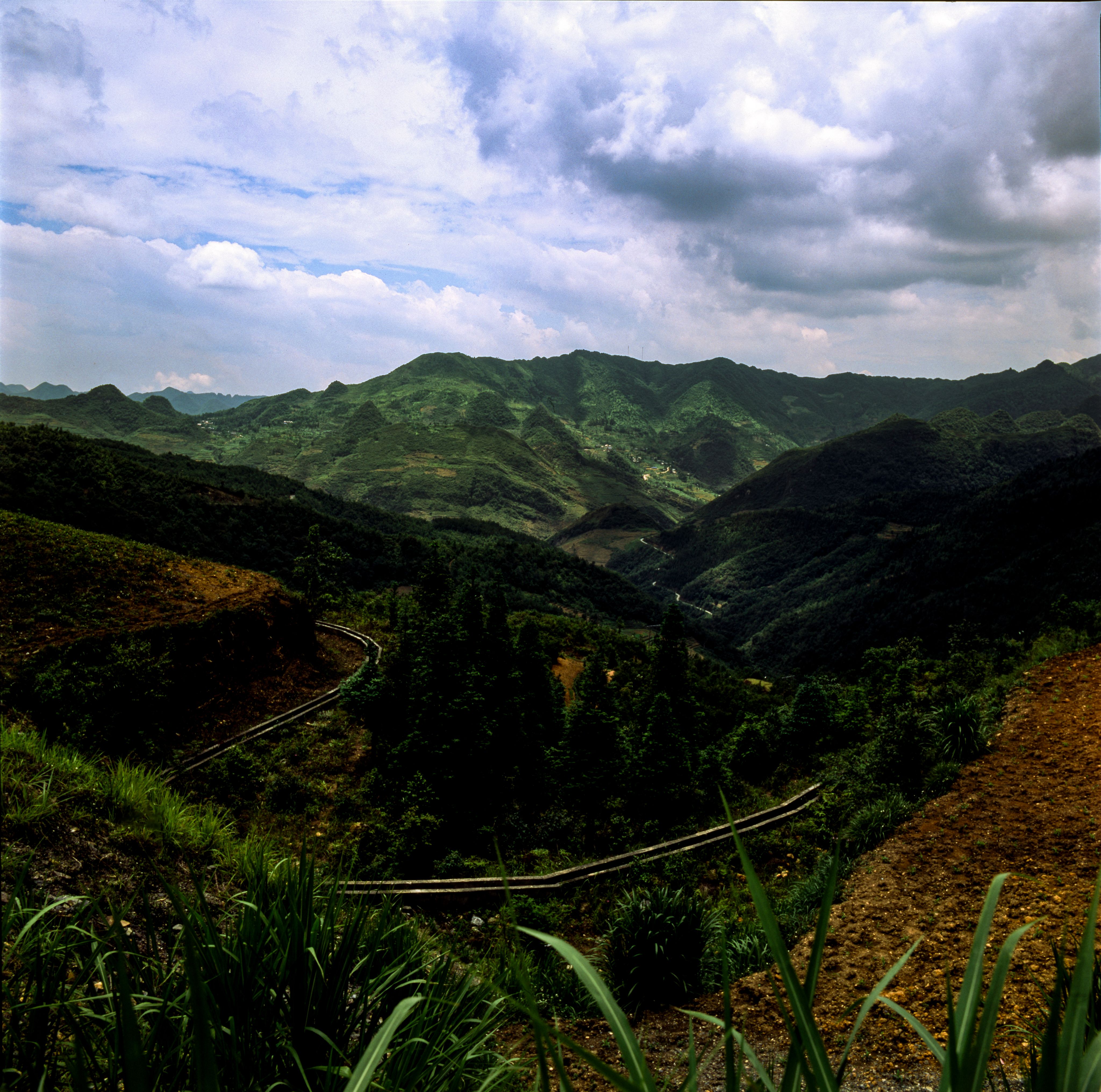 A scenic view of a valley with mountains and hills · Free Stock Photo
