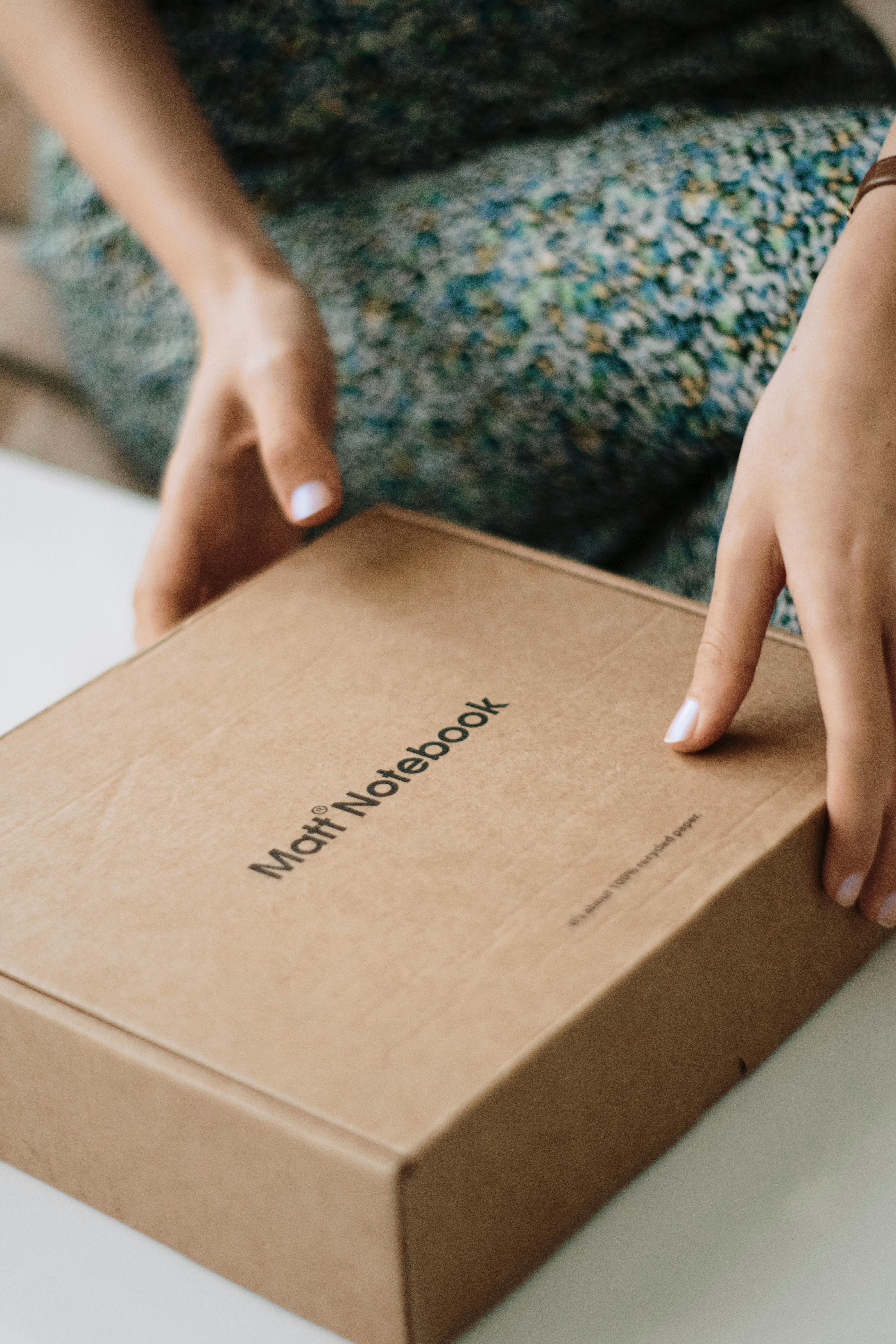 Woman Hands Holding Cardboard Box · Free Stock Photo
