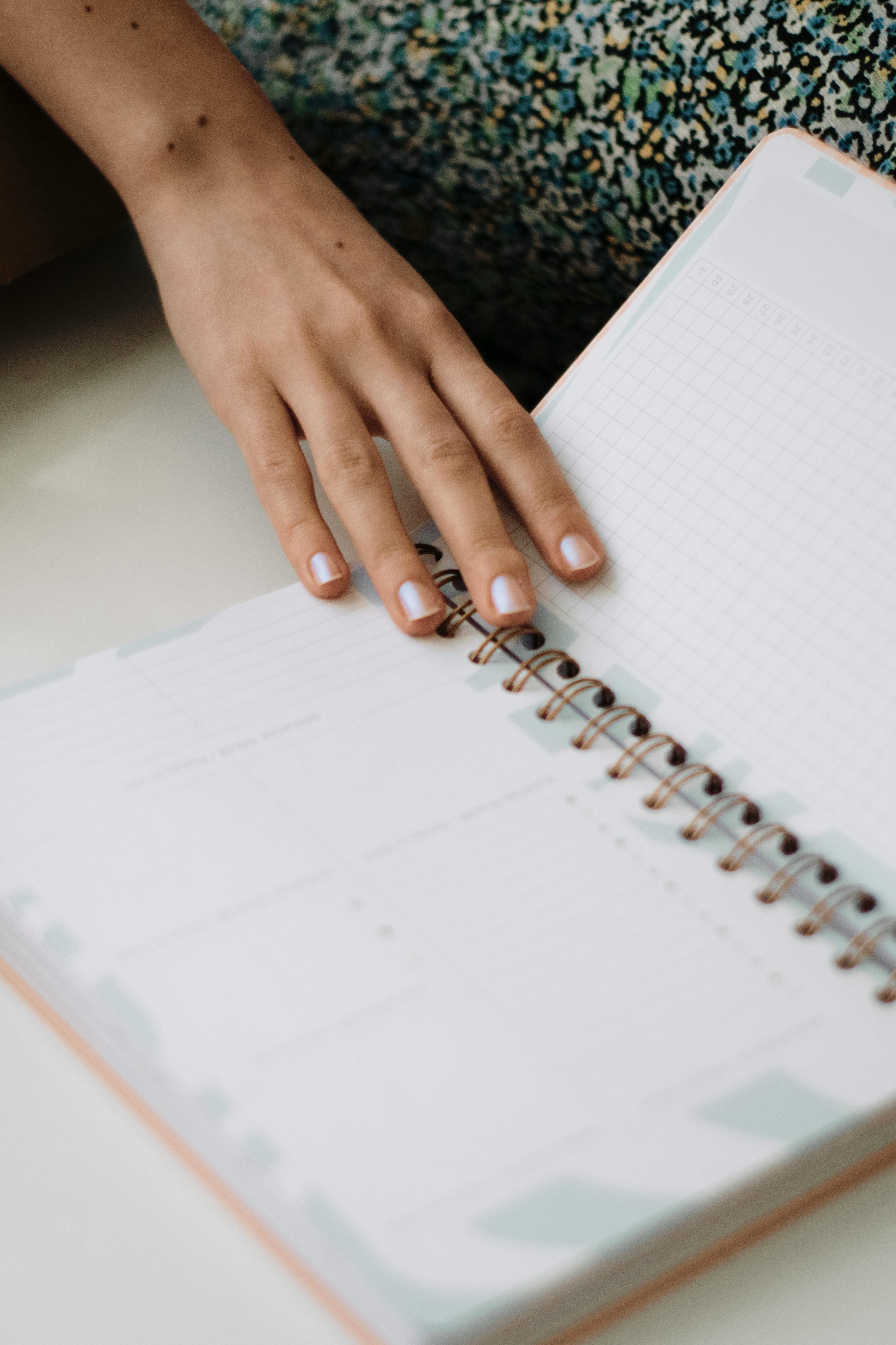 A Person Making a Schedule · Free Stock Photo