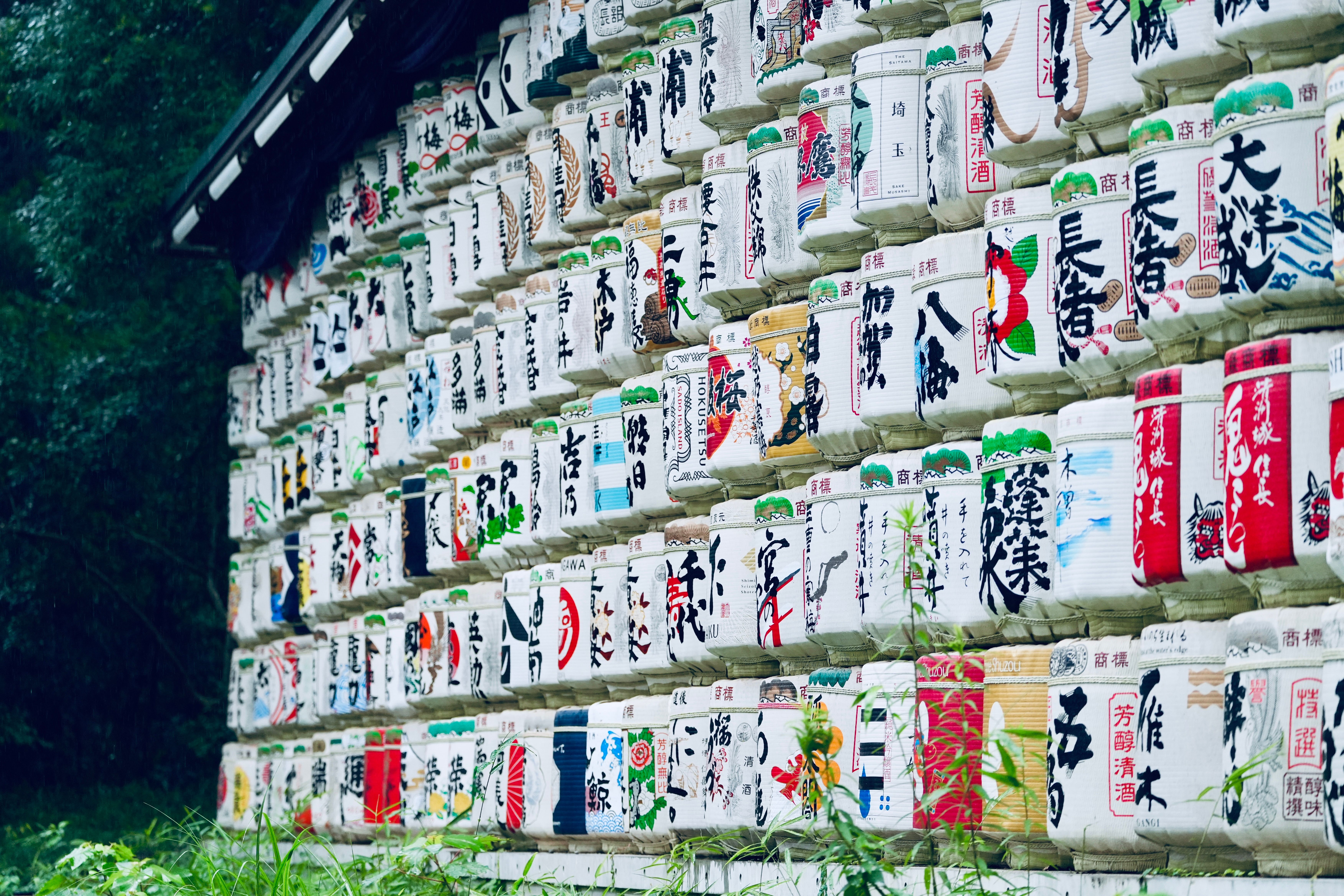 A wall covered in japanese writing and pictures · Free Stock Photo