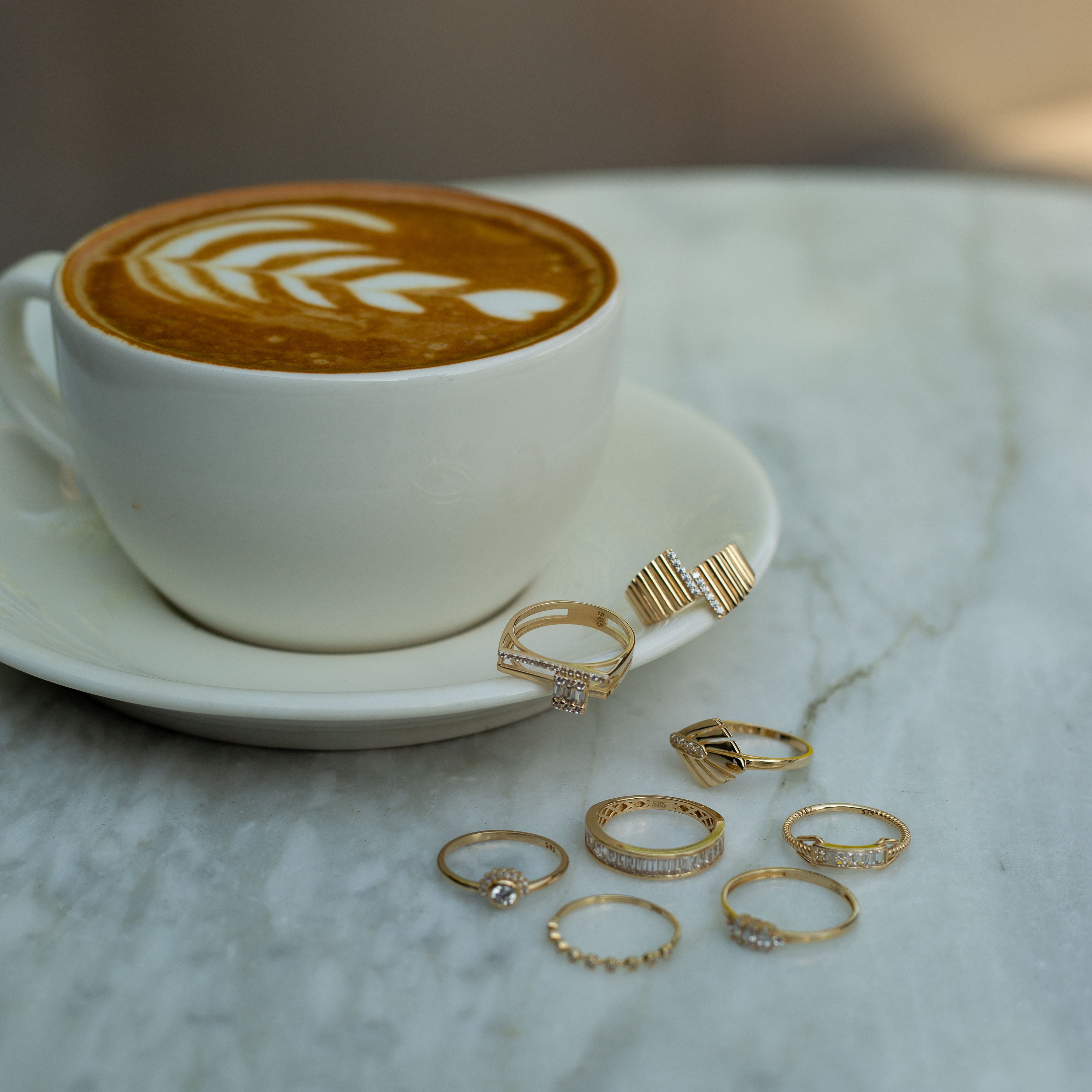 Gold Rings by Cup of Cappuccino · Free Stock Photo