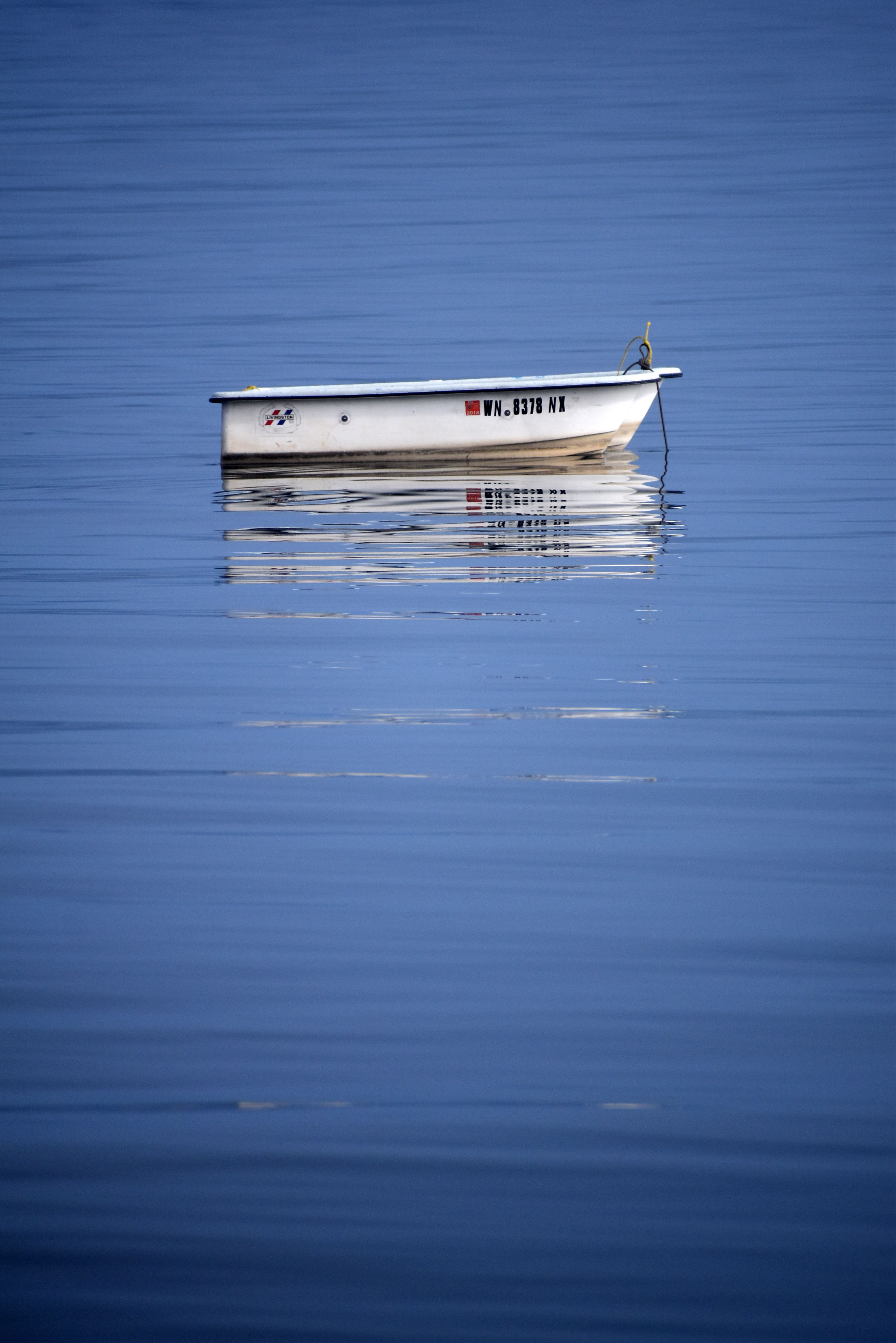 Empty Boat Floating in a Lake · Free Stock Photo