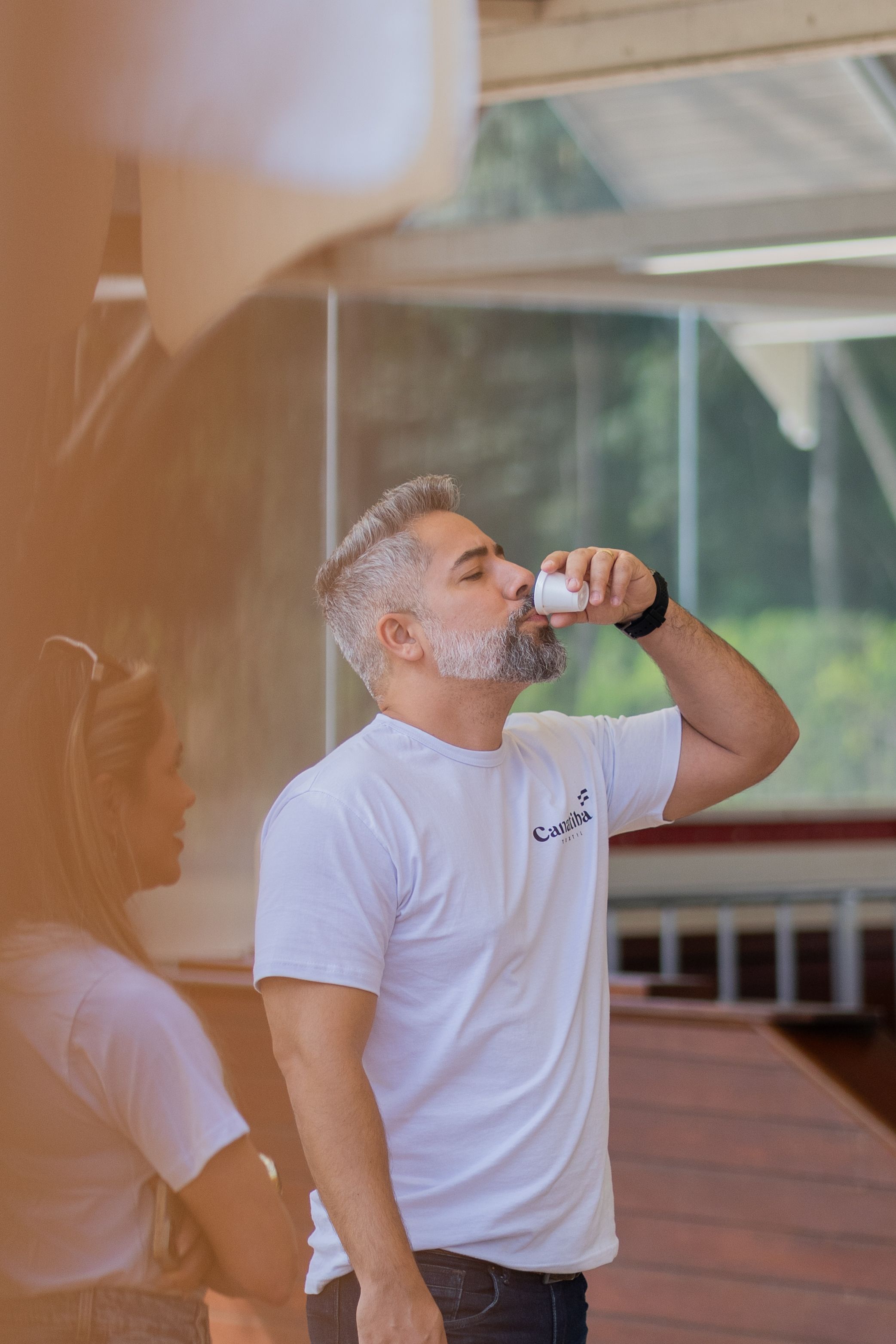 Man Standing and Drinking from Cup · Free Stock Photo