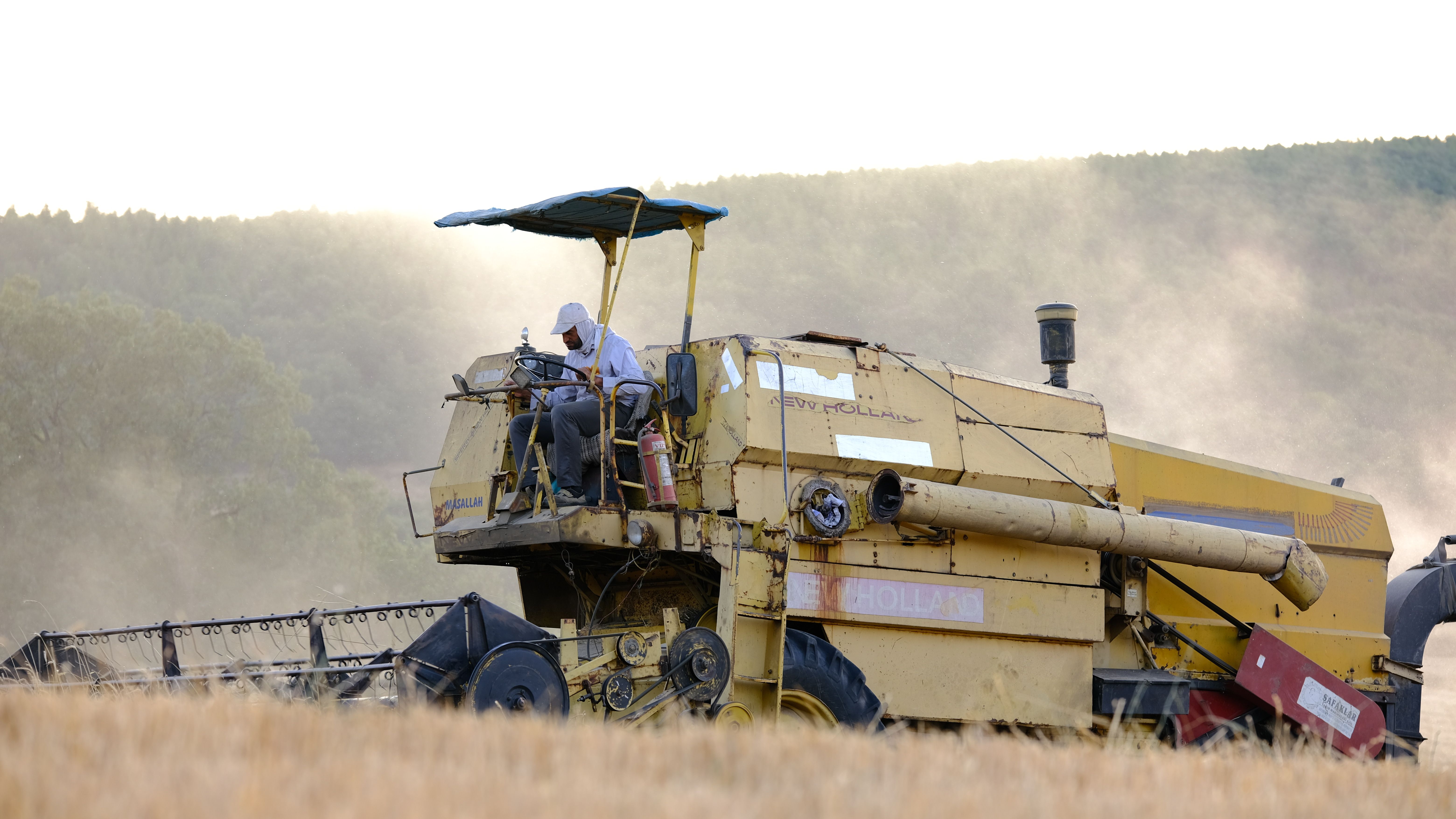 Farmer Harvesting Crops Using Combine Harvester · Free Stock Photo