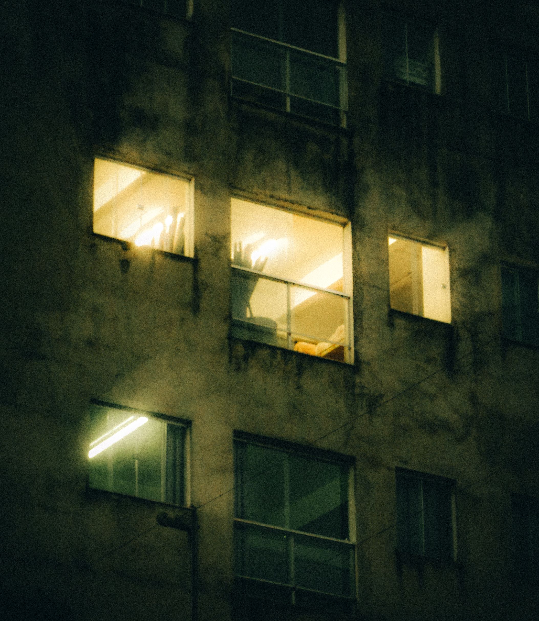 Light in Windows in Apartment Building at Night · Free Stock Photo