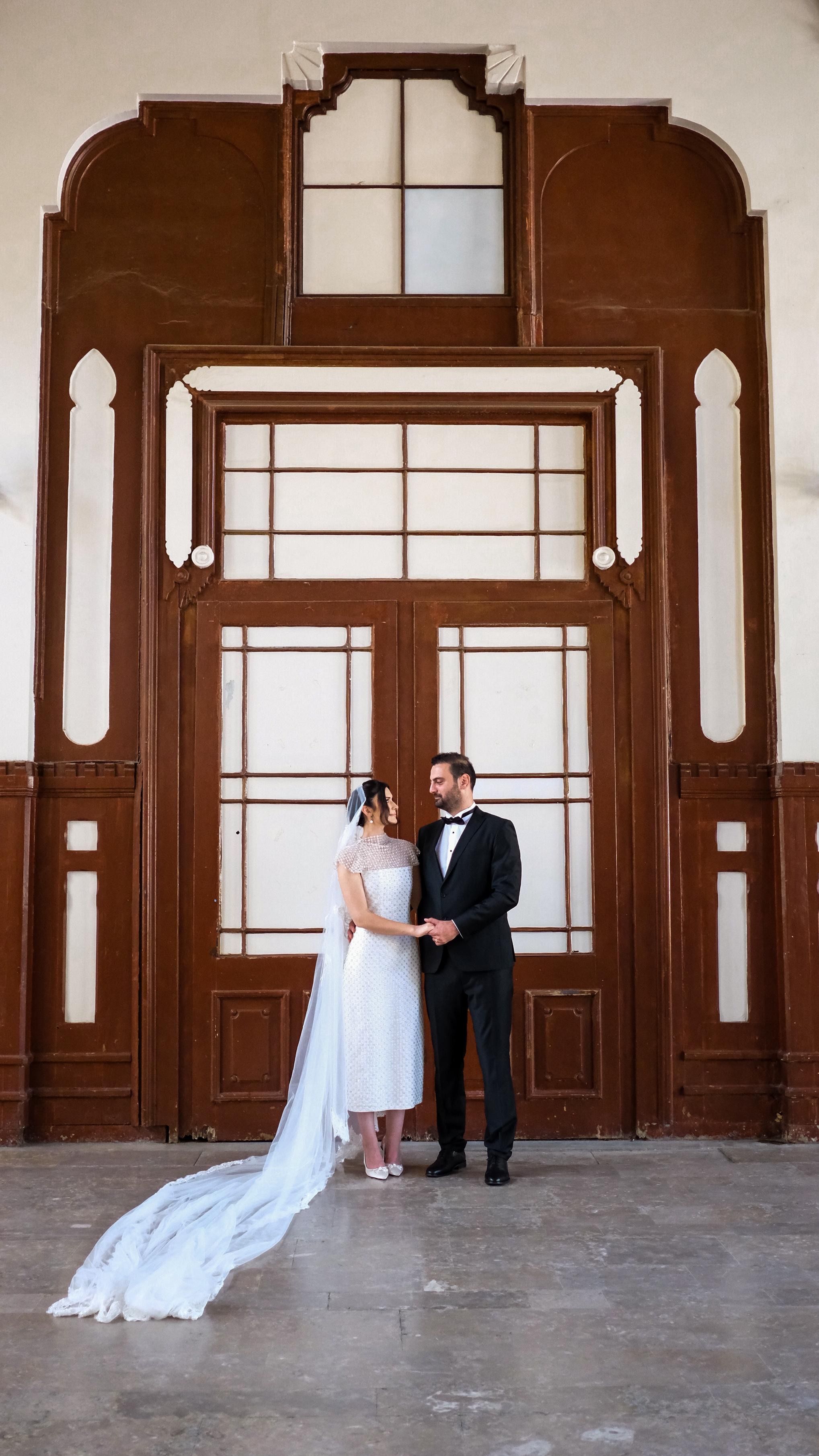 Newlyweds Standing Together in Wedding Dress and Suit · Free Stock Photo