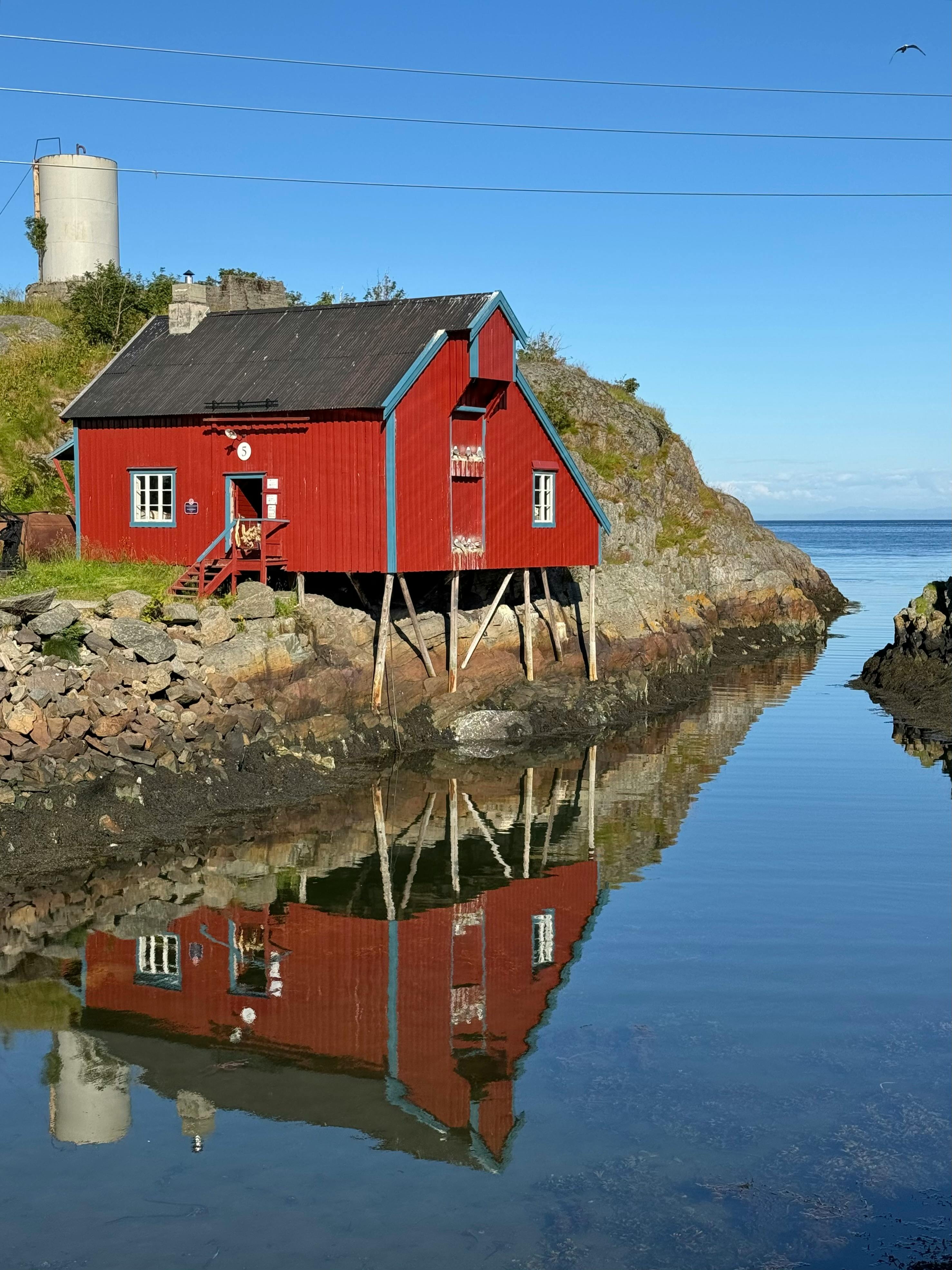 Red Hut on a Small Hill by the Seashore · Free Stock Photo